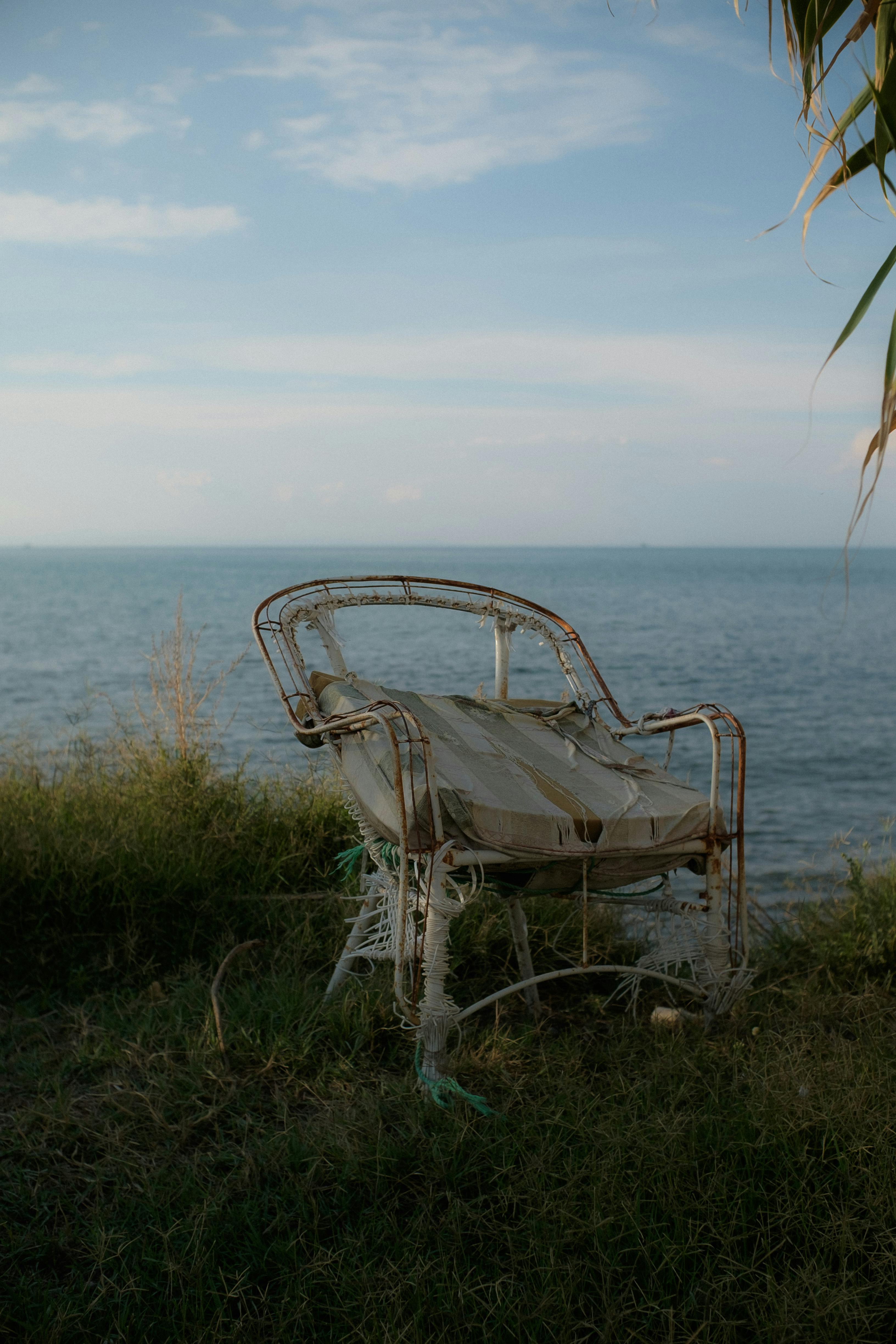 Destroyed Chair on Sea Shore · Free Stock Photo