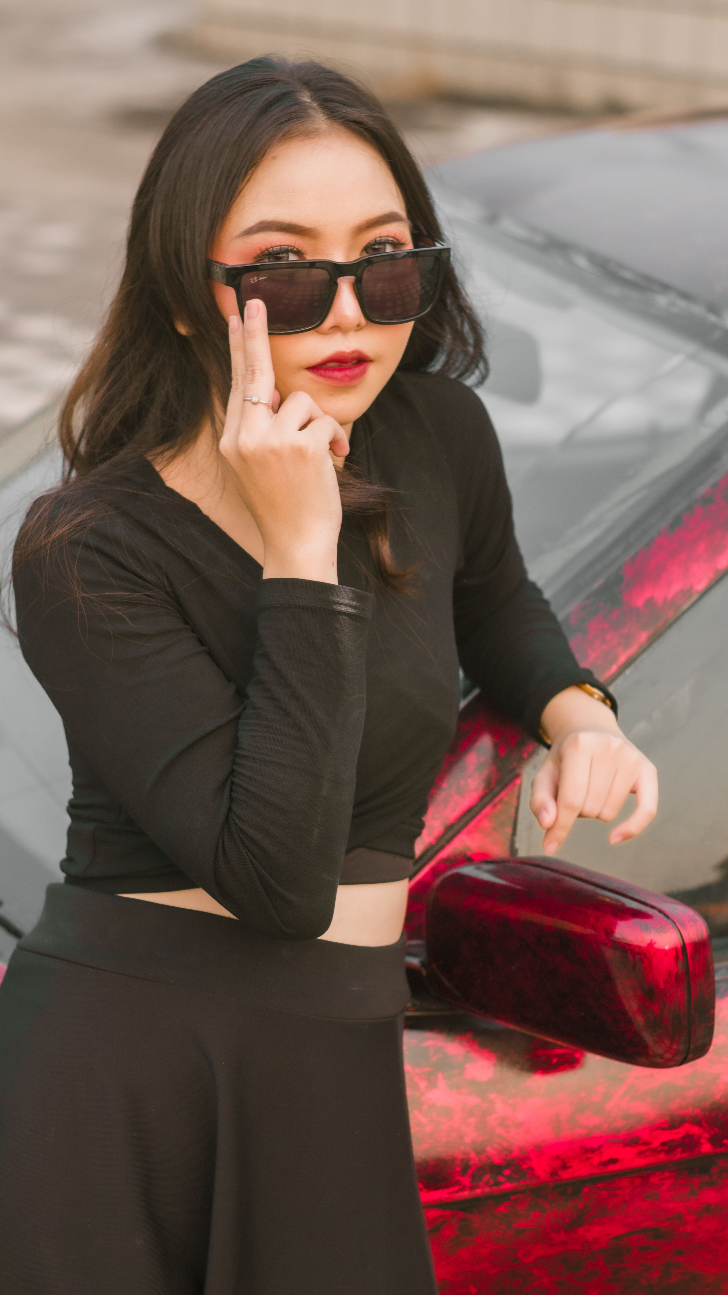 Young Elegant Woman Leaning against a Car · Free Stock Photo
