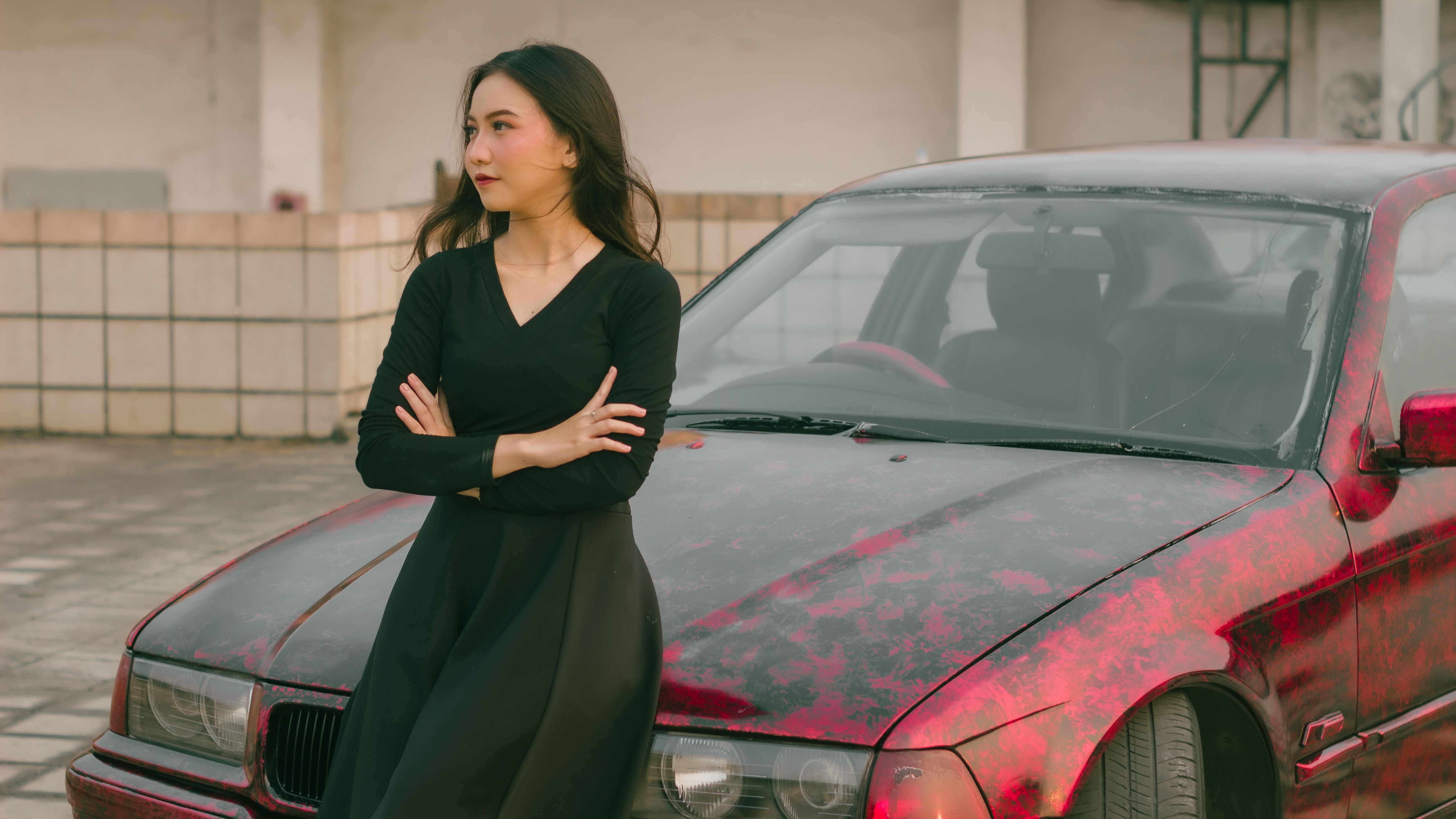 Person Poses While Leaning on Car Bonnet · Free Stock Photo