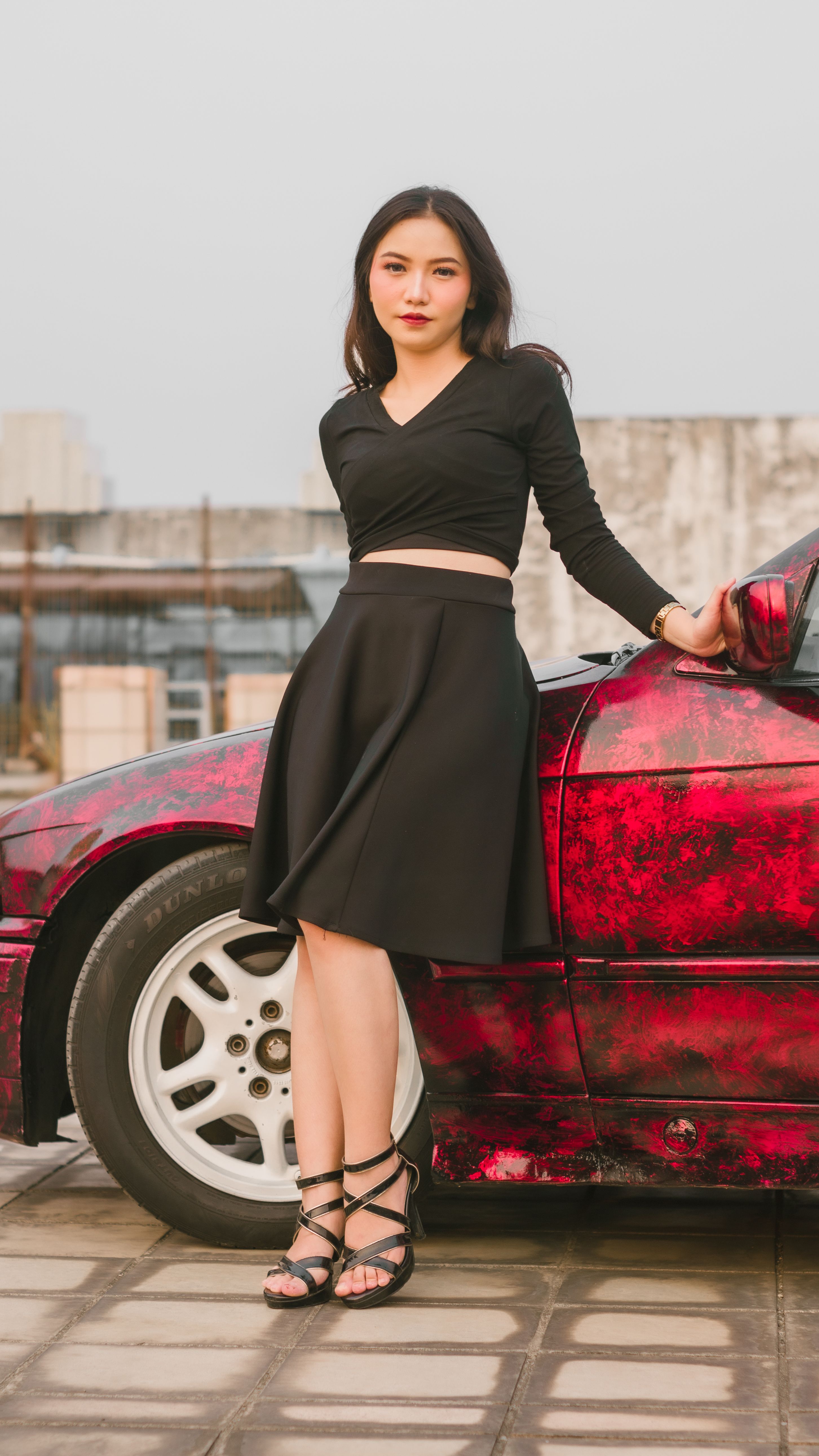 Young Elegant Woman Leaning against a Car · Free Stock Photo