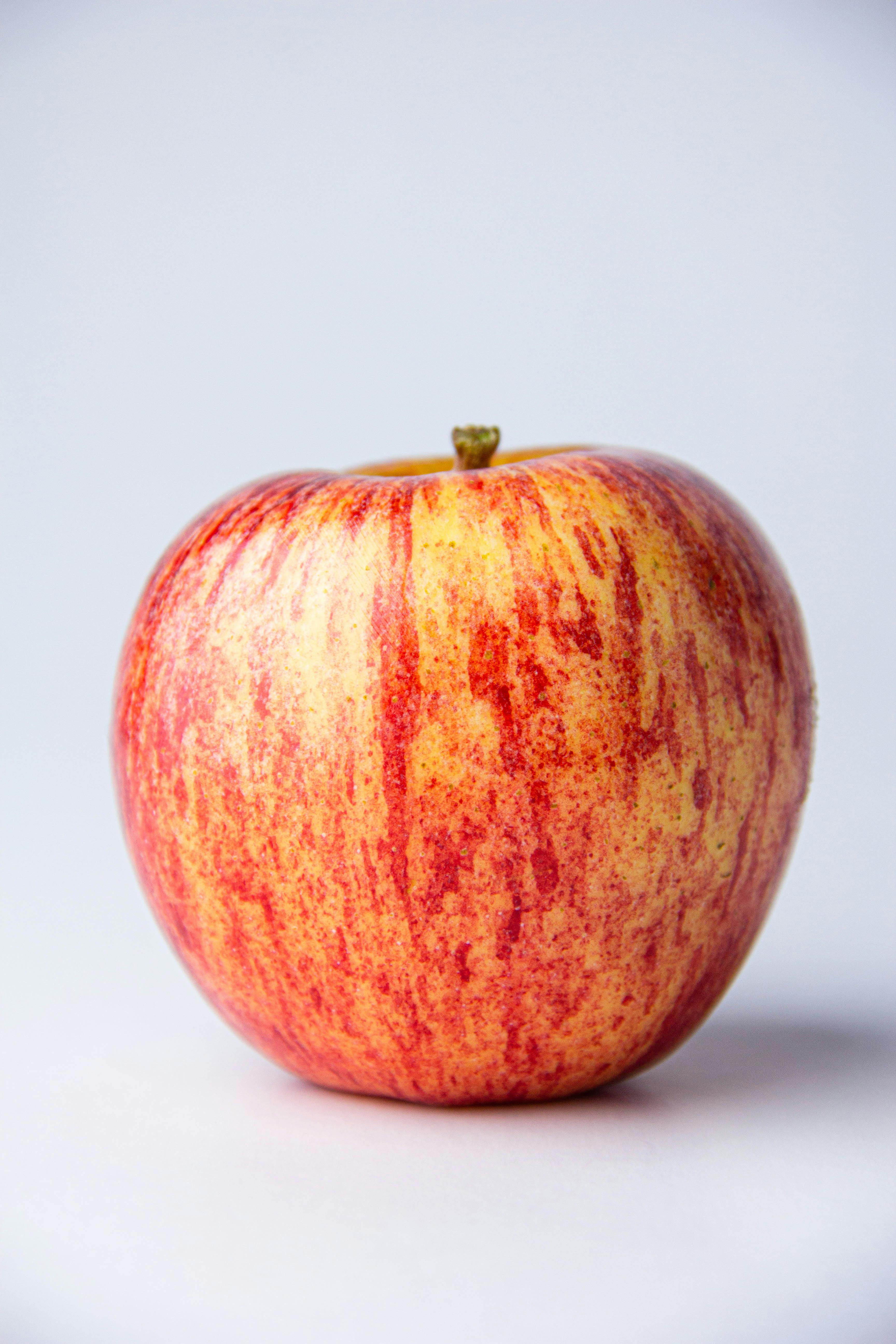 White Apple on Beige Background · Free Stock Photo