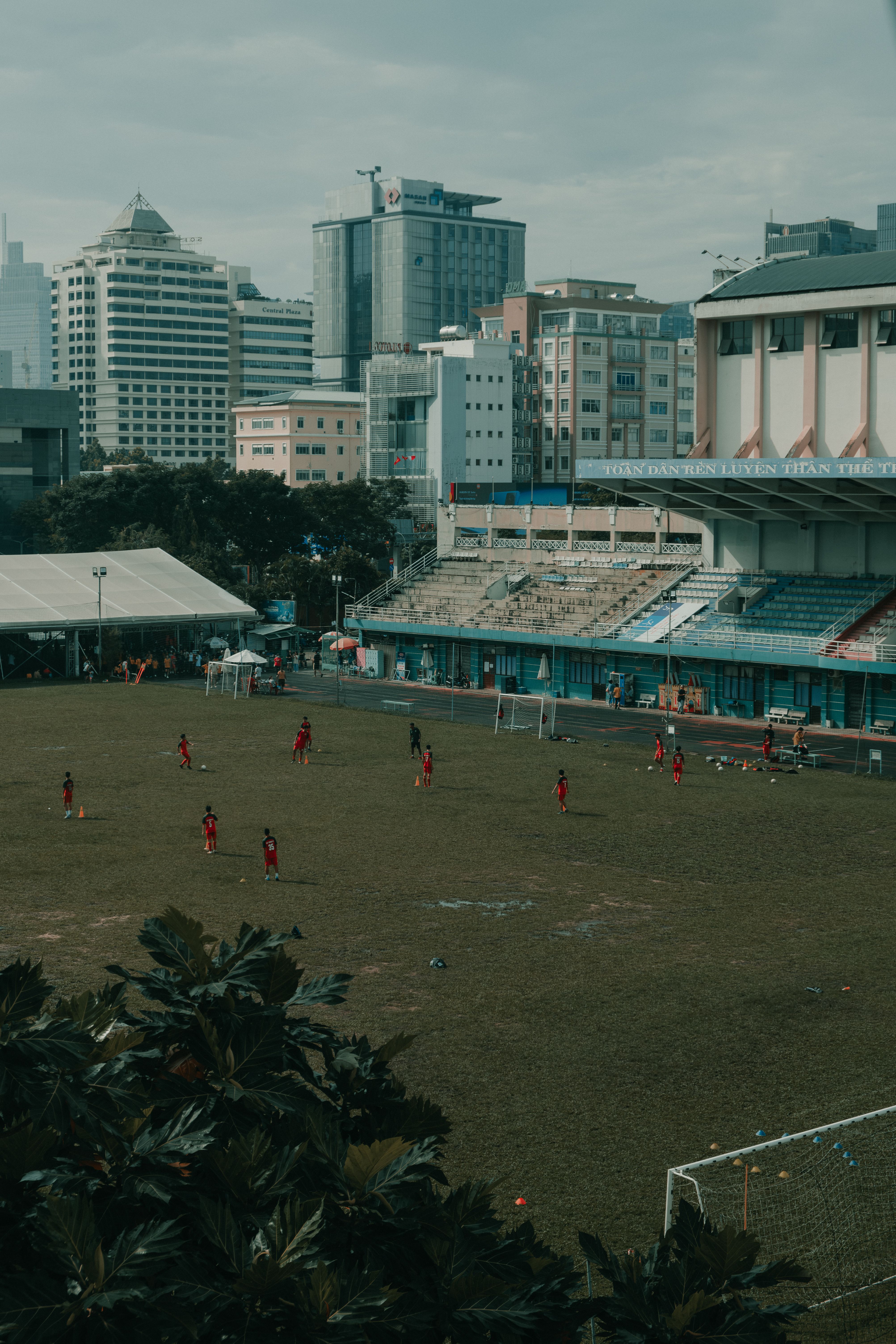 View of People Playing Soccer on a Stadium in City · Free Stock Photo
