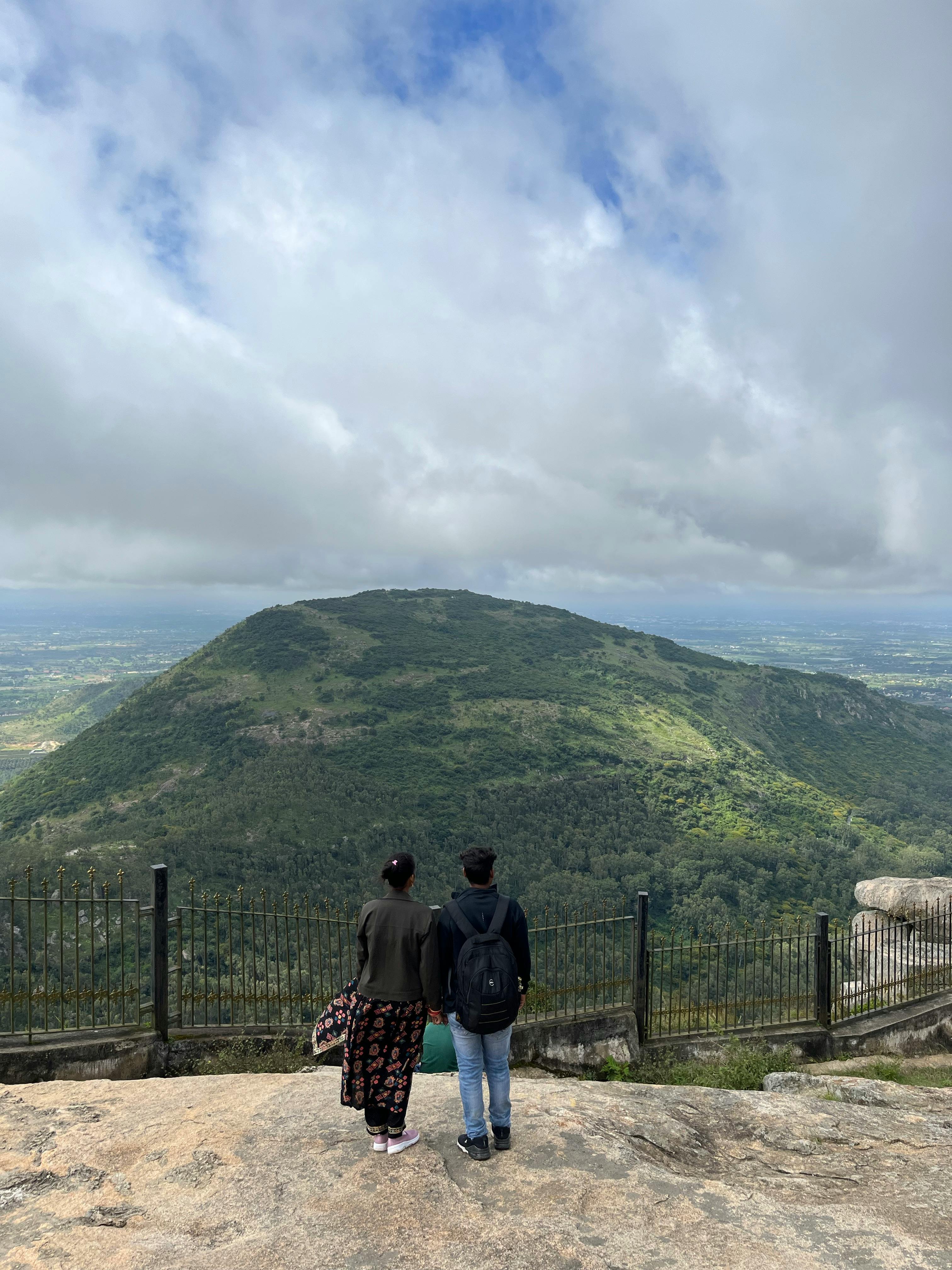 Back View of Woman Standing on Top of the Hill and Looking at the View ...