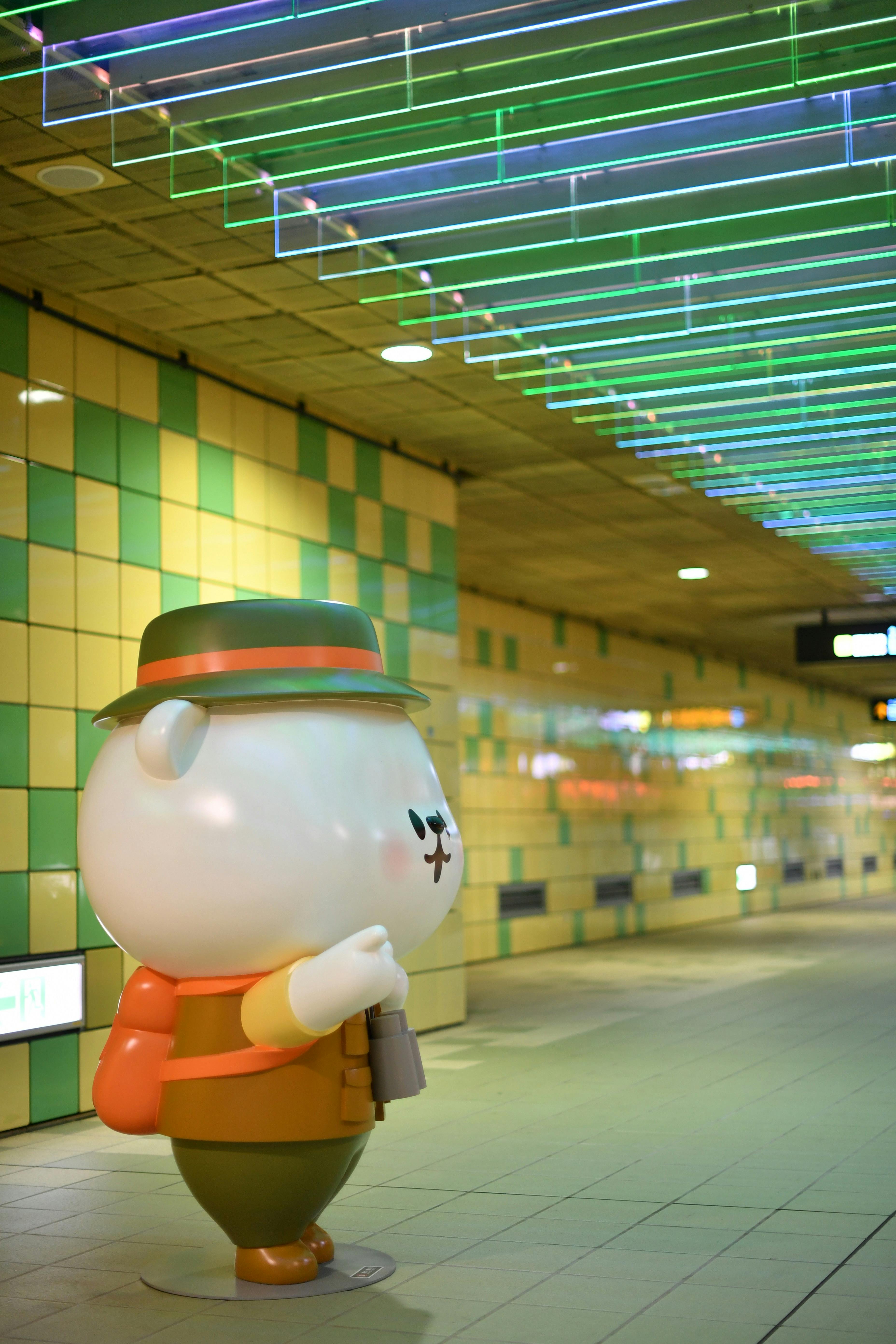 Mondo Mascot on Colorful Subway Platform · Free Stock Photo