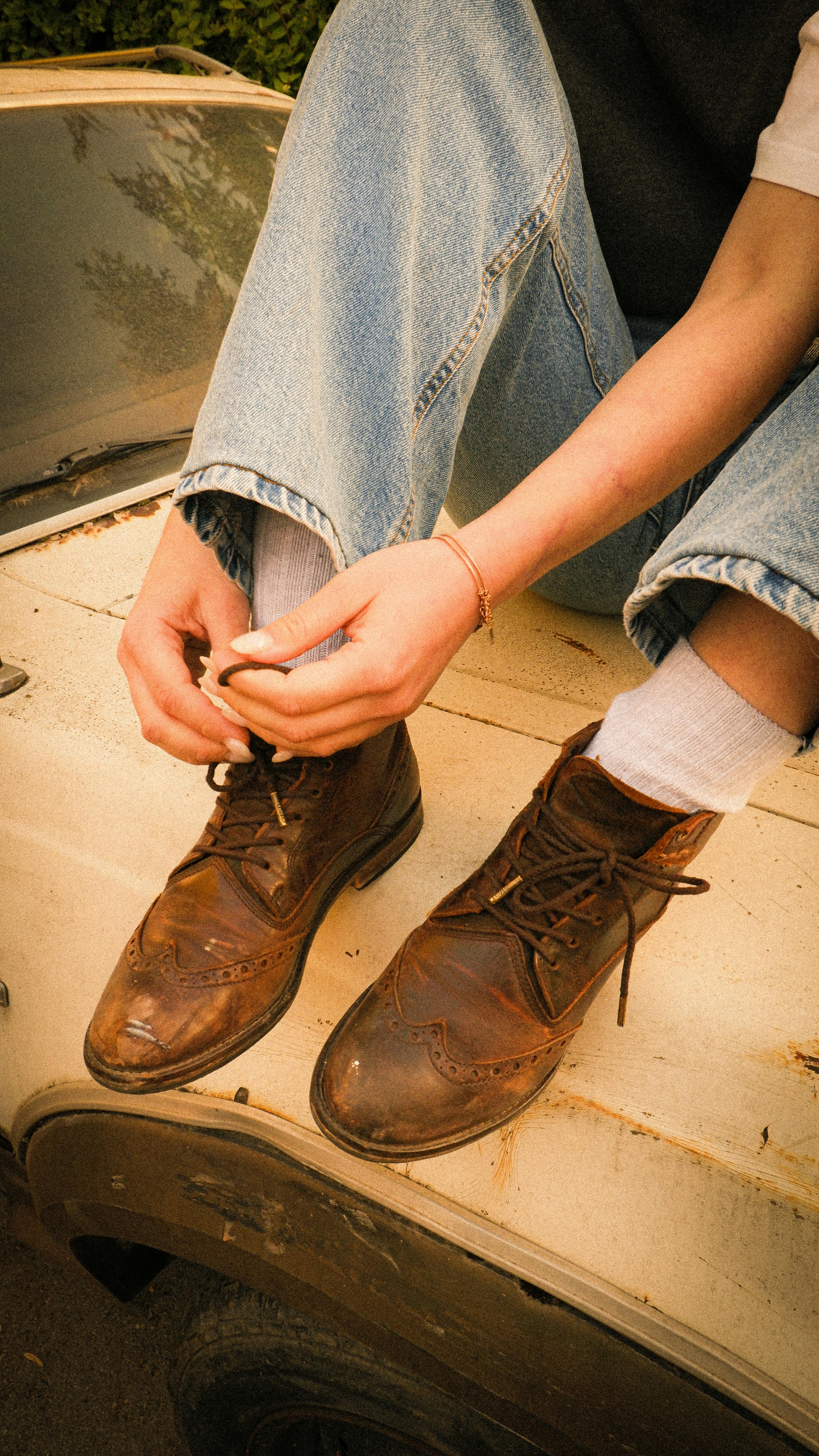 A Person Tying Shoes · Free Stock Photo