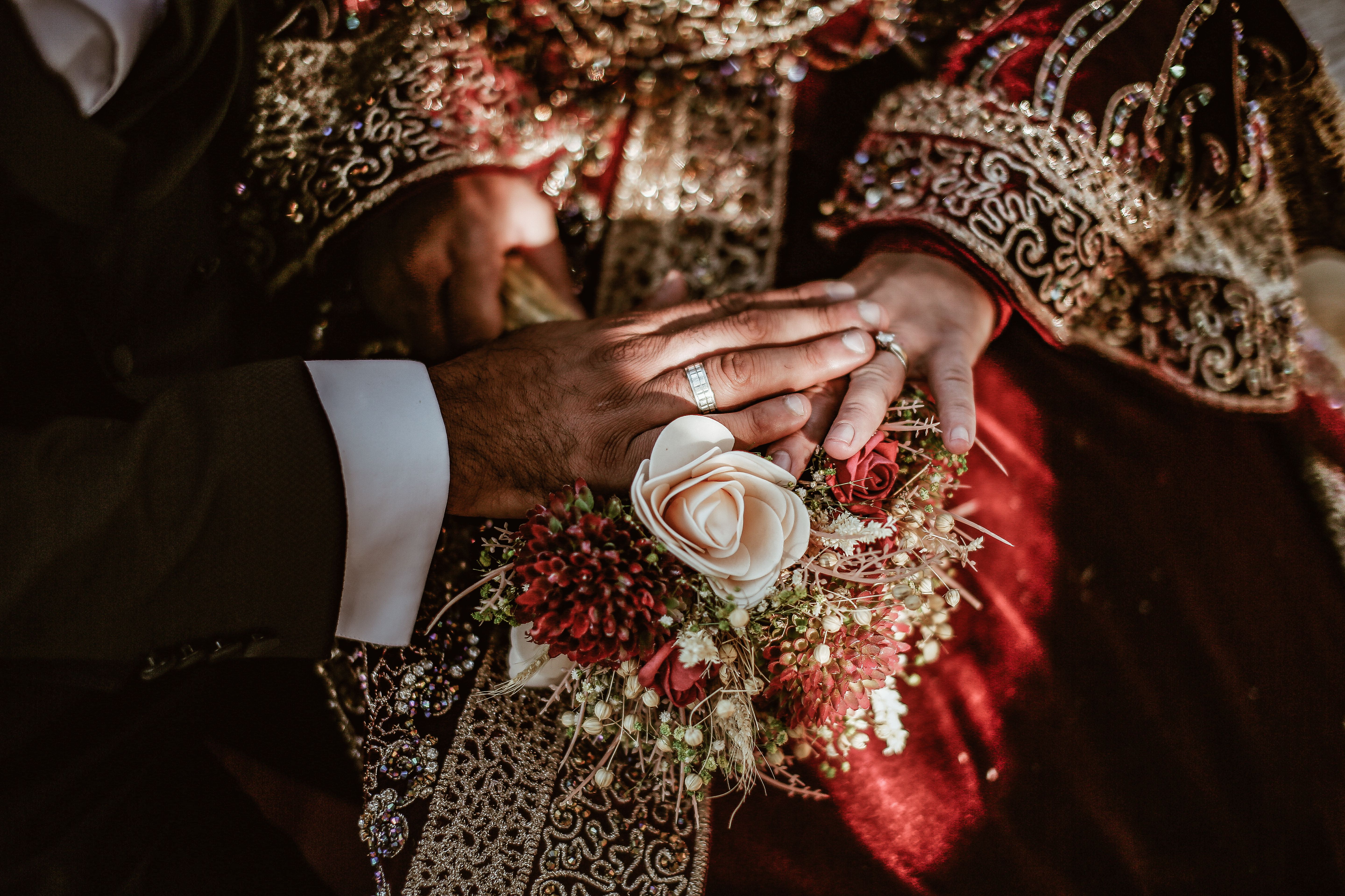 Close-up of Bride and Groom Showing Their Wedding Rings · Free Stock Photo