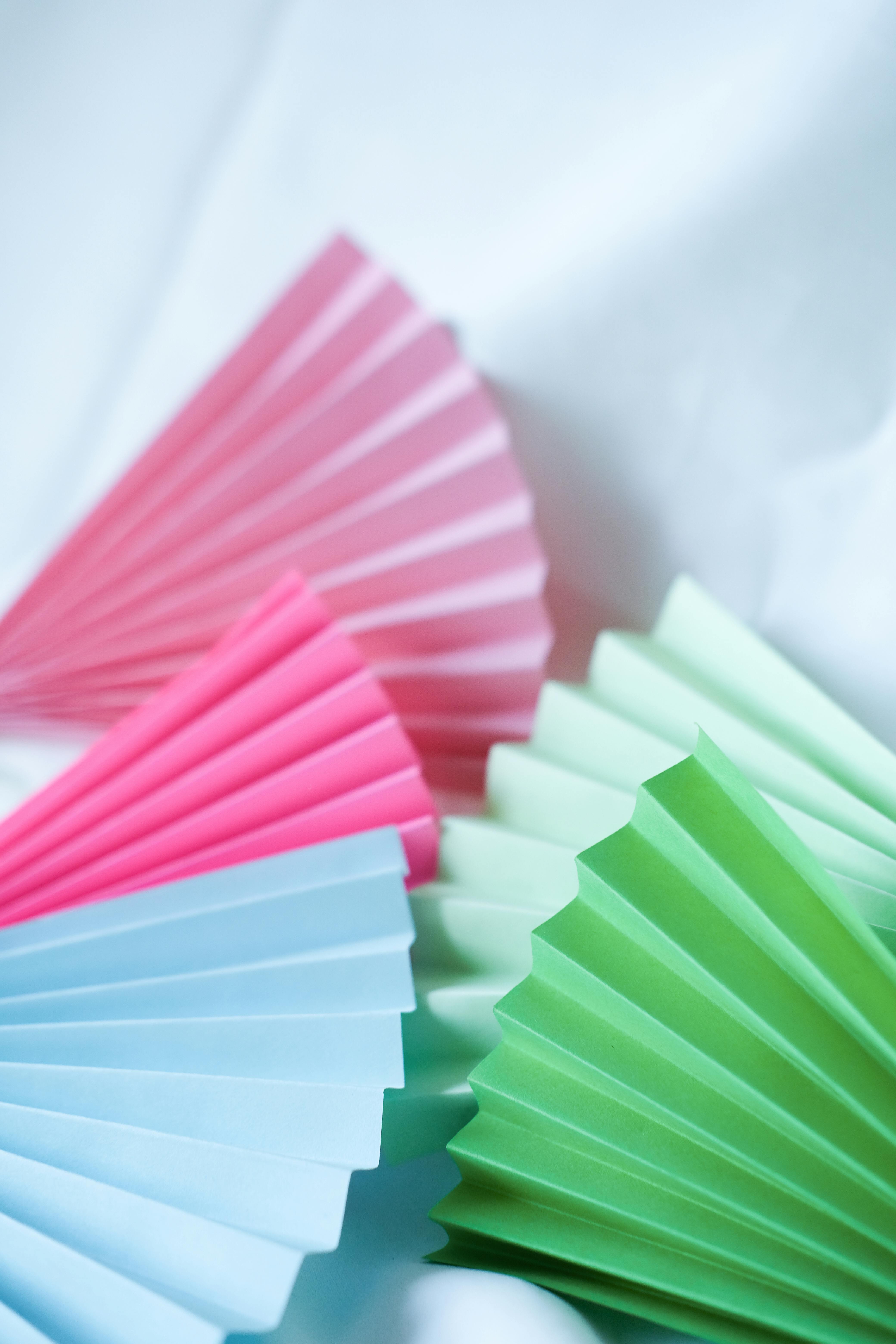 Fans of Folded Colored Paper · Free Stock Photo