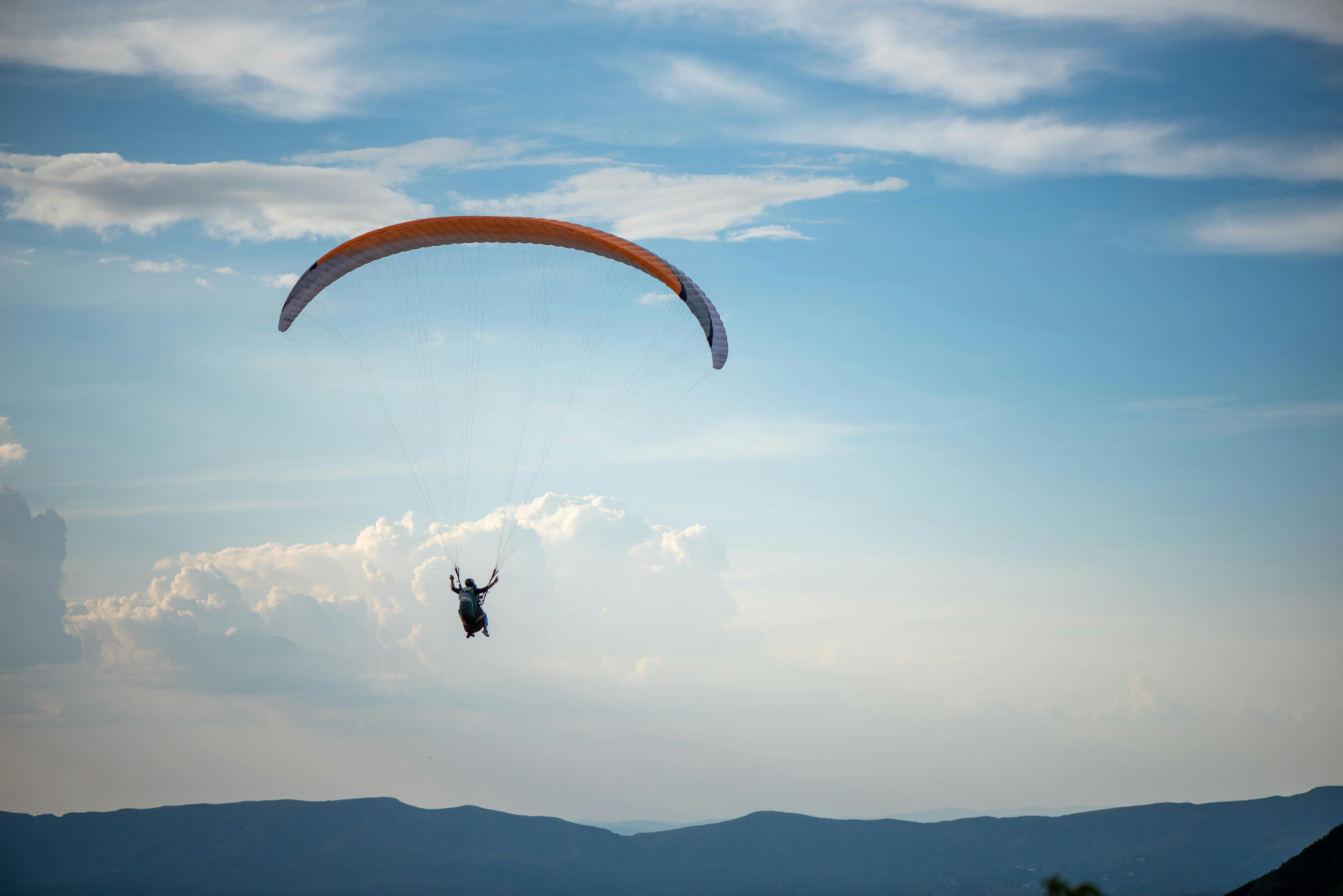 Couple Parachuting on Sky · Free Stock Photo