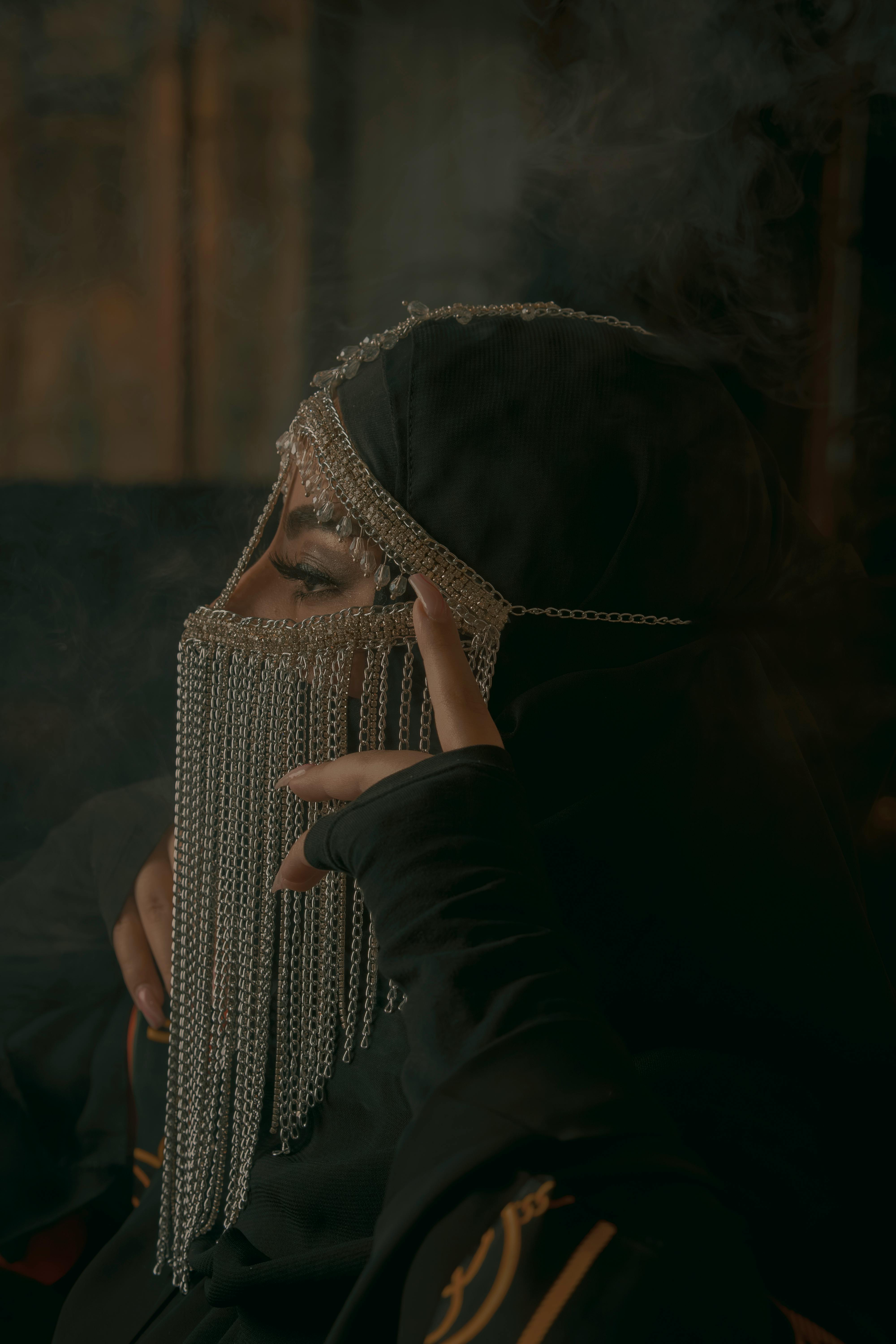 Side View of a Woman Wearing a Headscarf and a Face Veil · Free Stock Photo