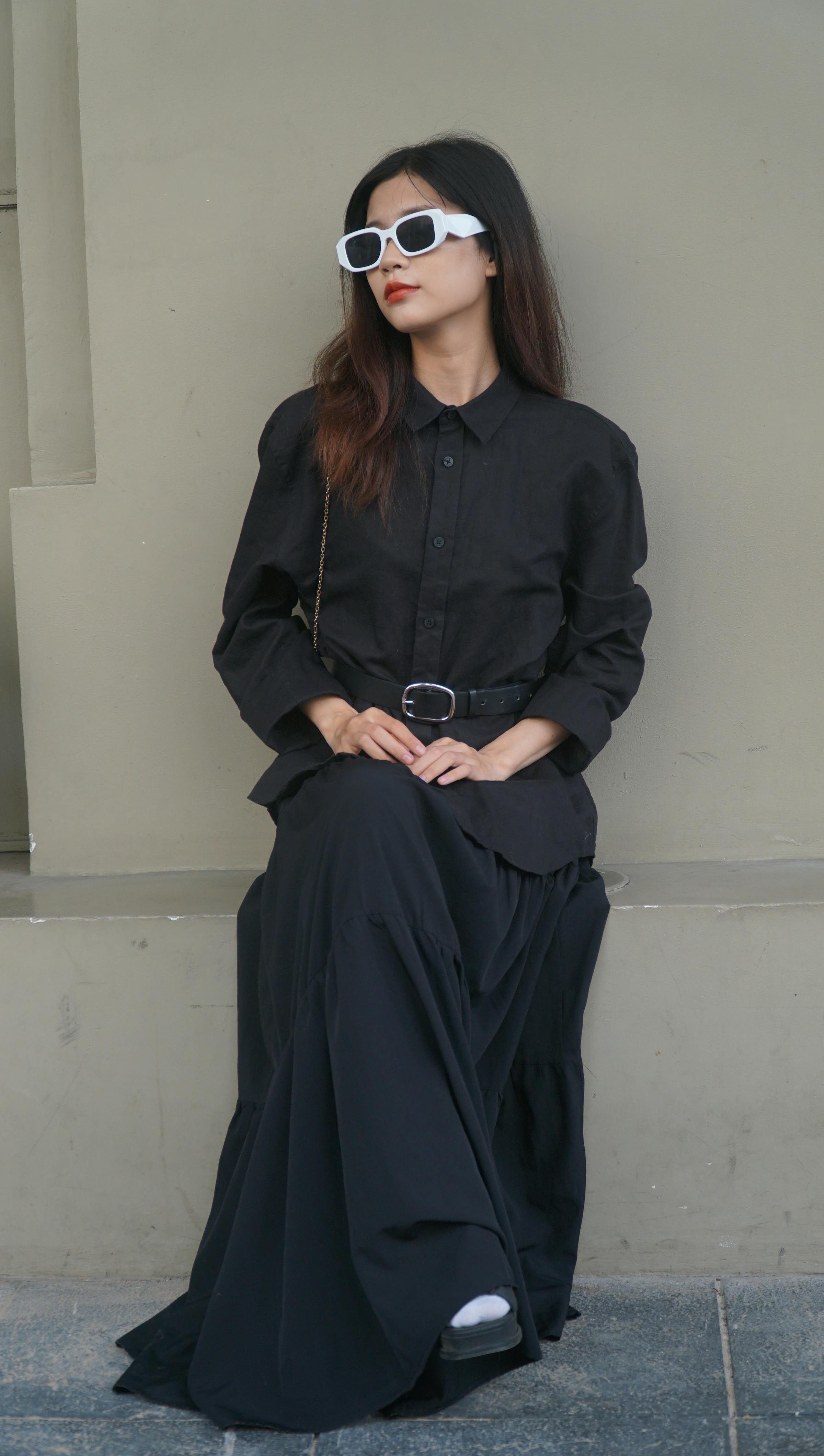 Brunette Woman with Bucket Hat Sitting with Drink in Hand · Free Stock ...