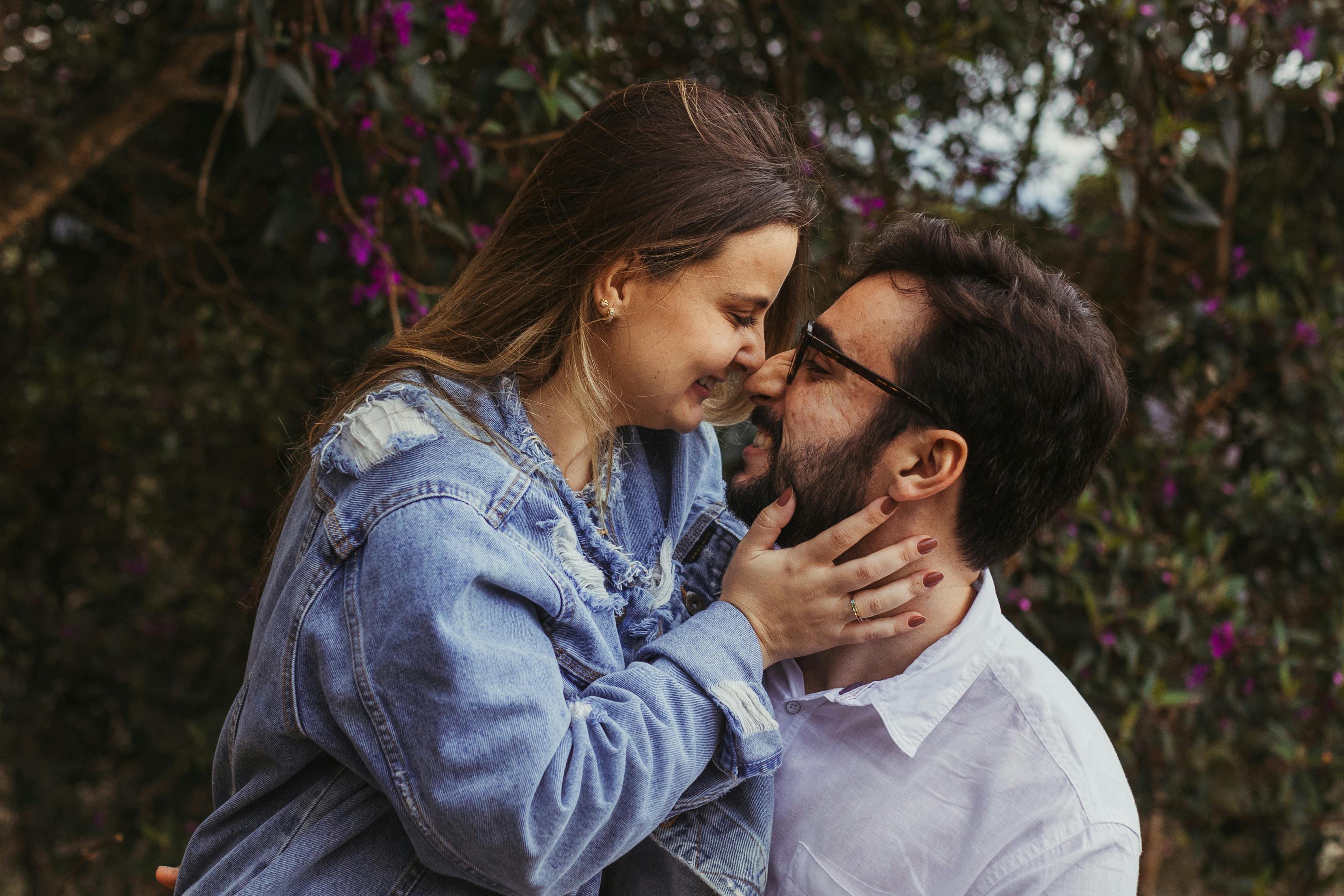 A Couple Almost Kissing and Smiling · Free Stock Photo