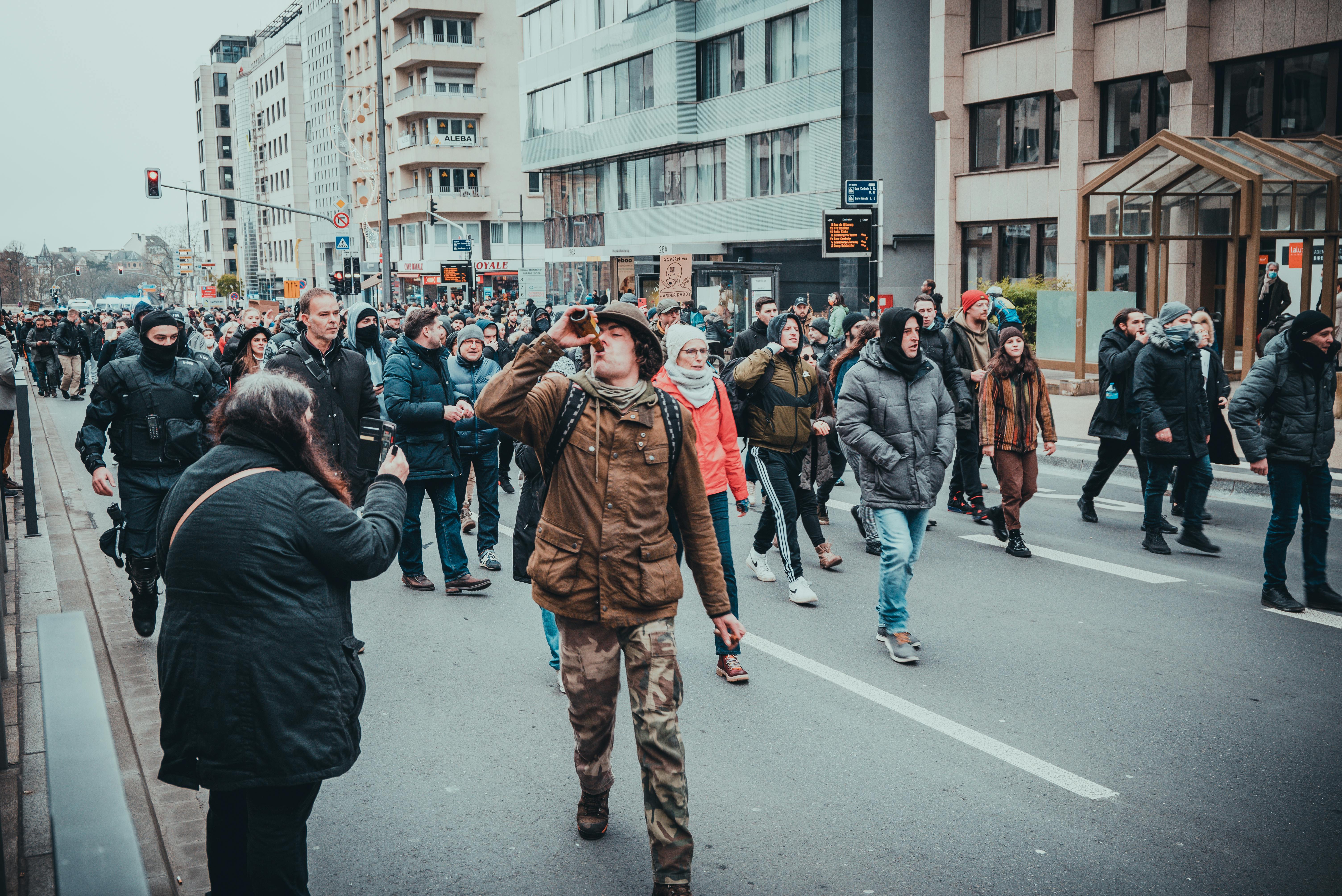 Protesters March in Street · Free Stock Photo