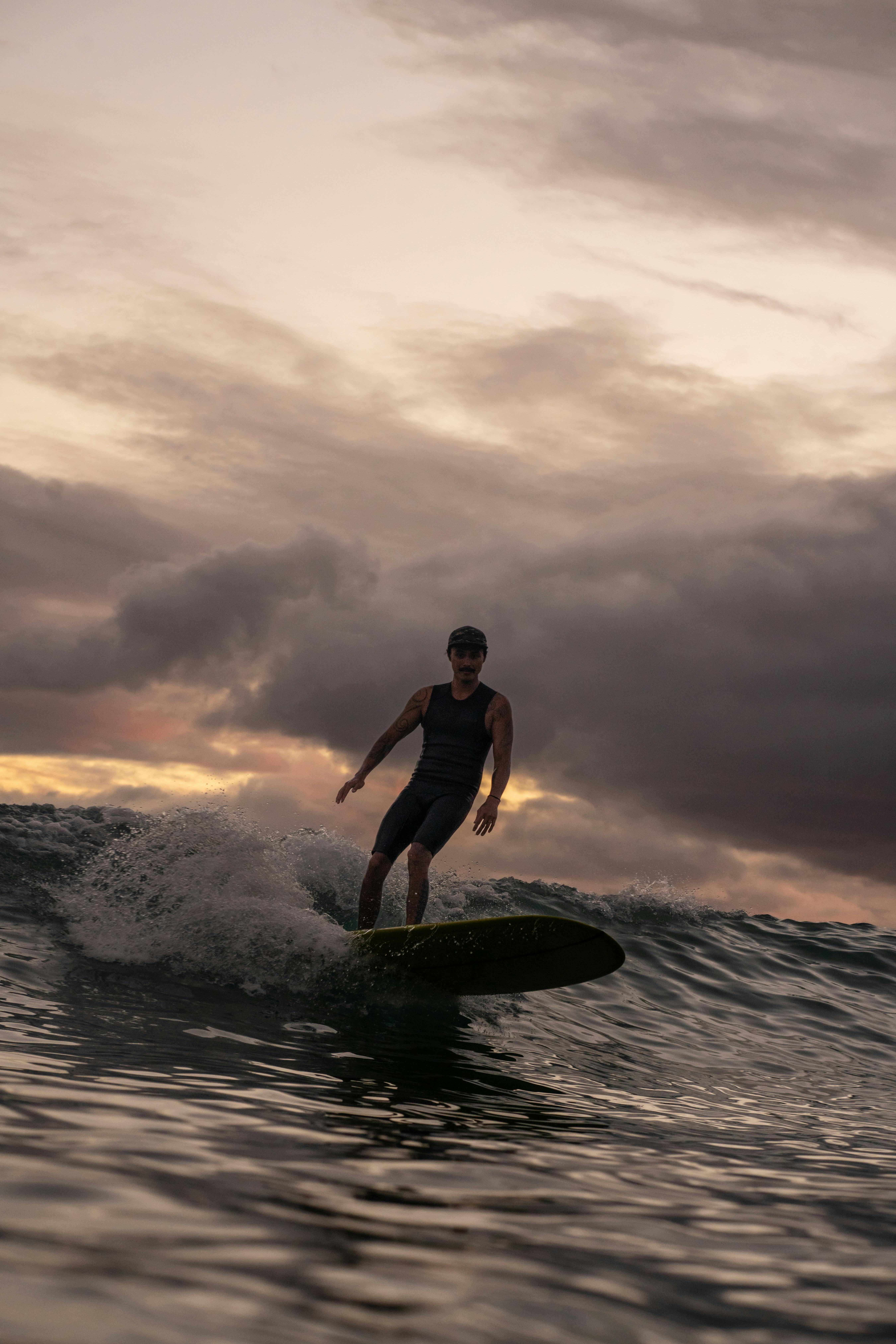 Surfer on Wave at Sunset · Free Stock Photo