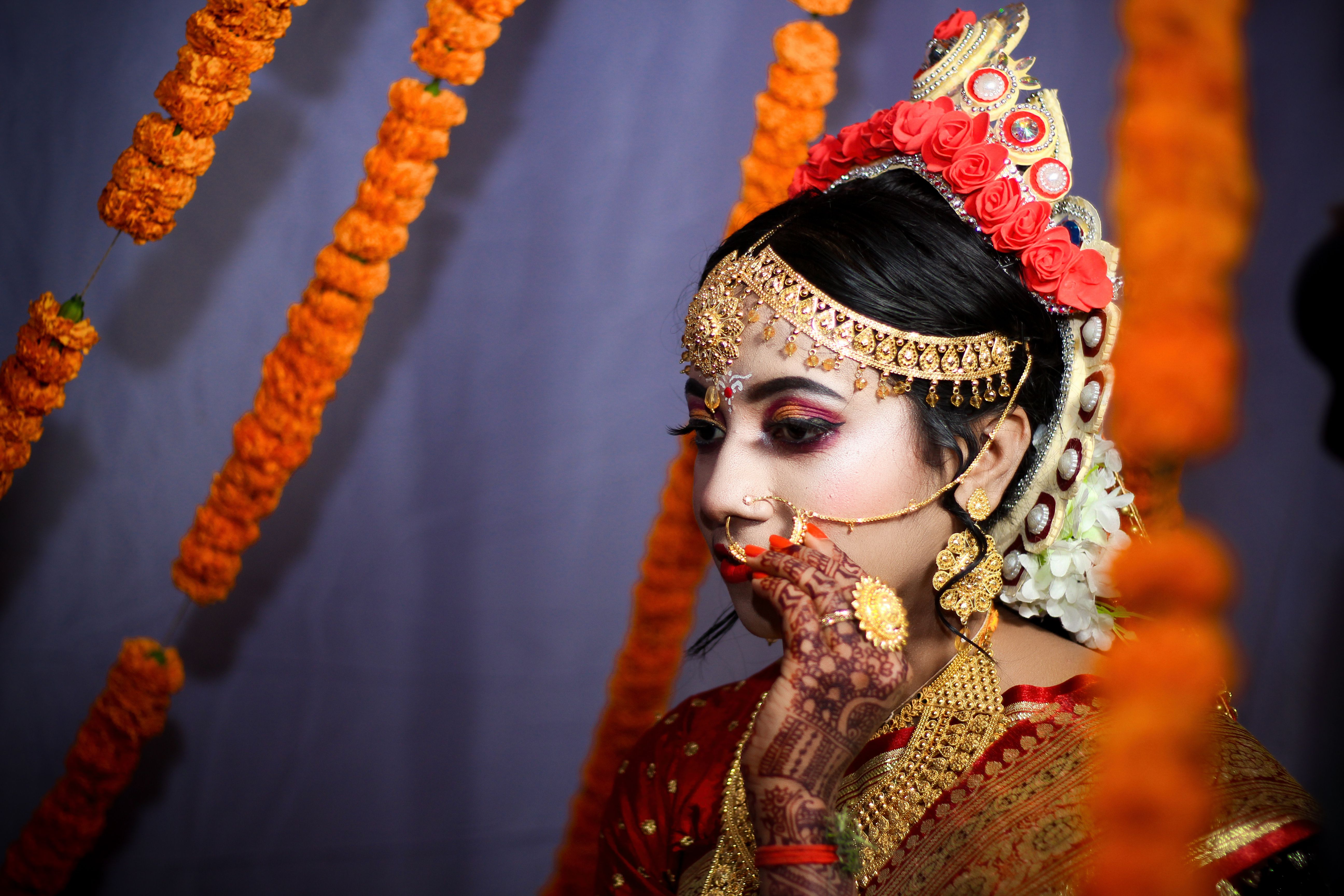 Bride Putting On a Traditional Nath Nose Ring · Free Stock Photo