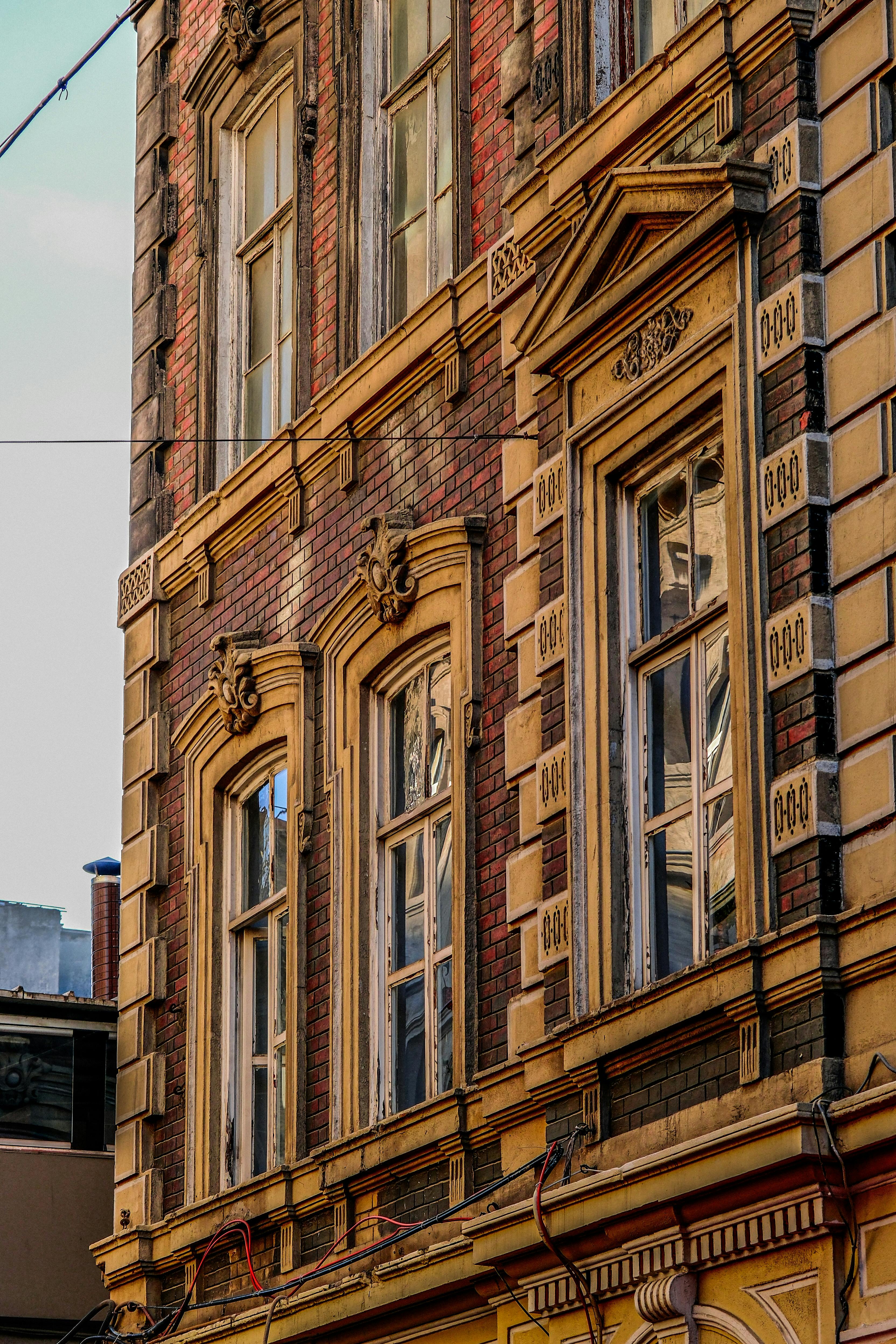 Facade of an Old Tenement House in Neoclassic Style · Free Stock Photo