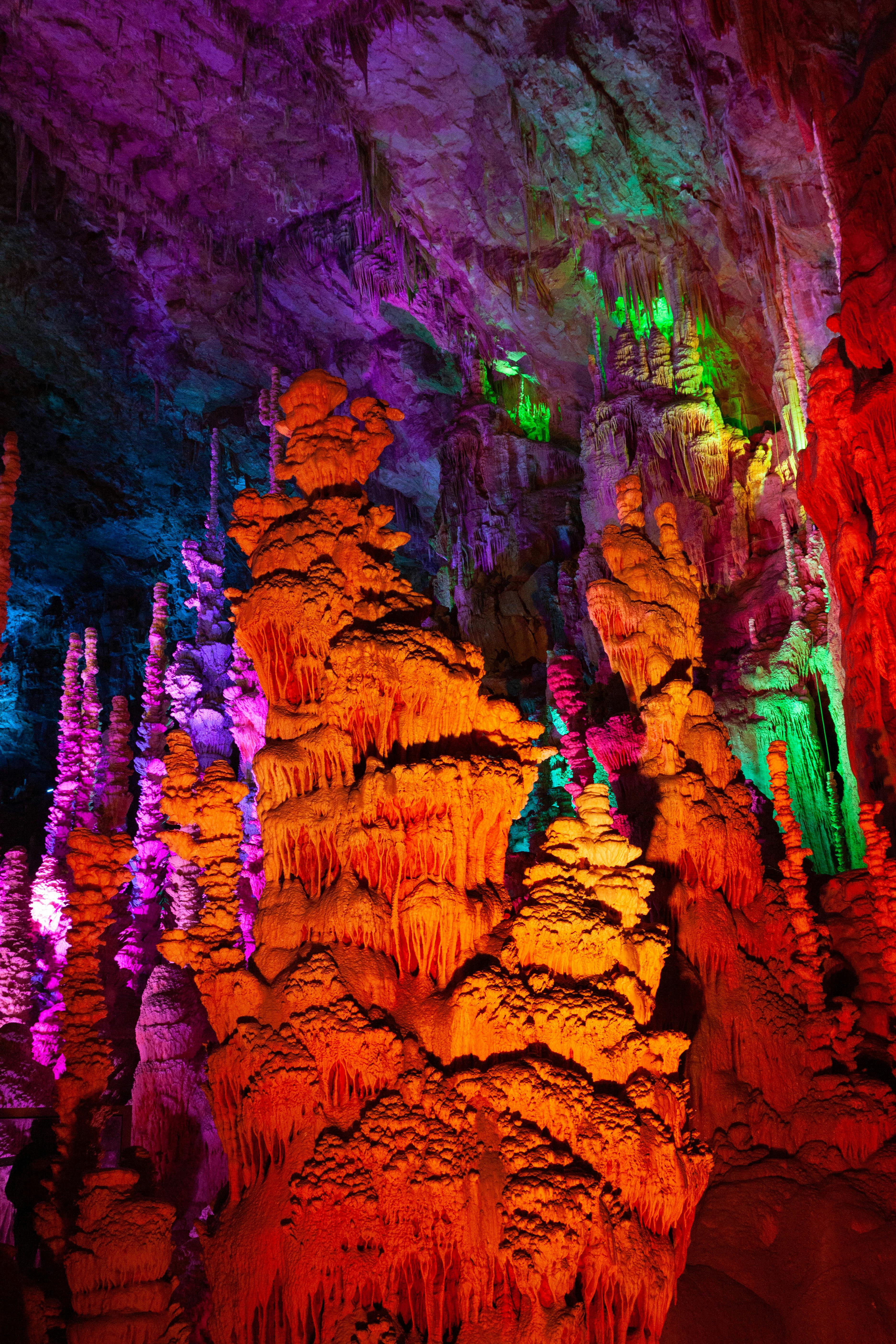 A colorful cave with many different colored rocks · Free Stock Photo