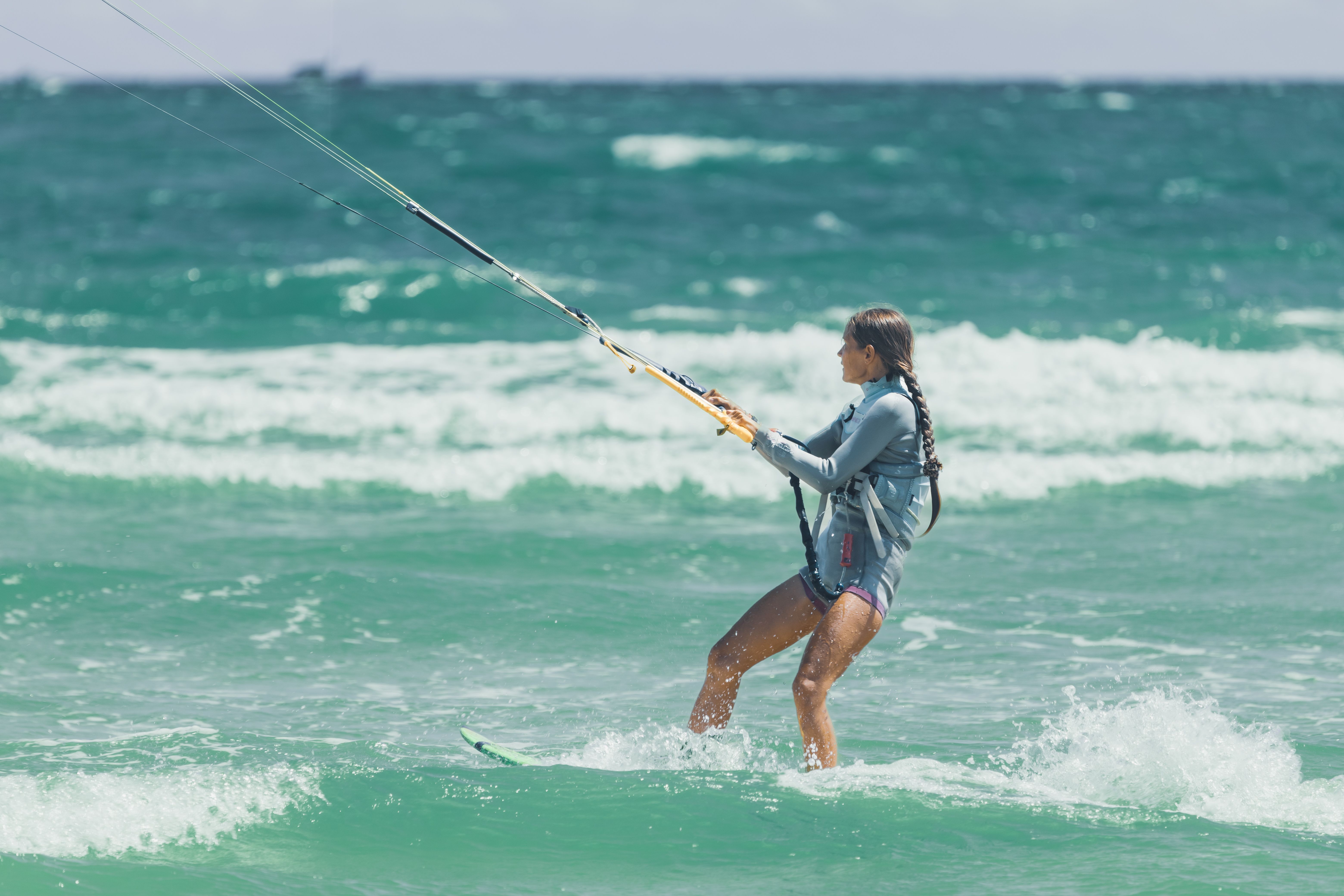 Woman Kitesurfing on Waves · Free Stock Photo