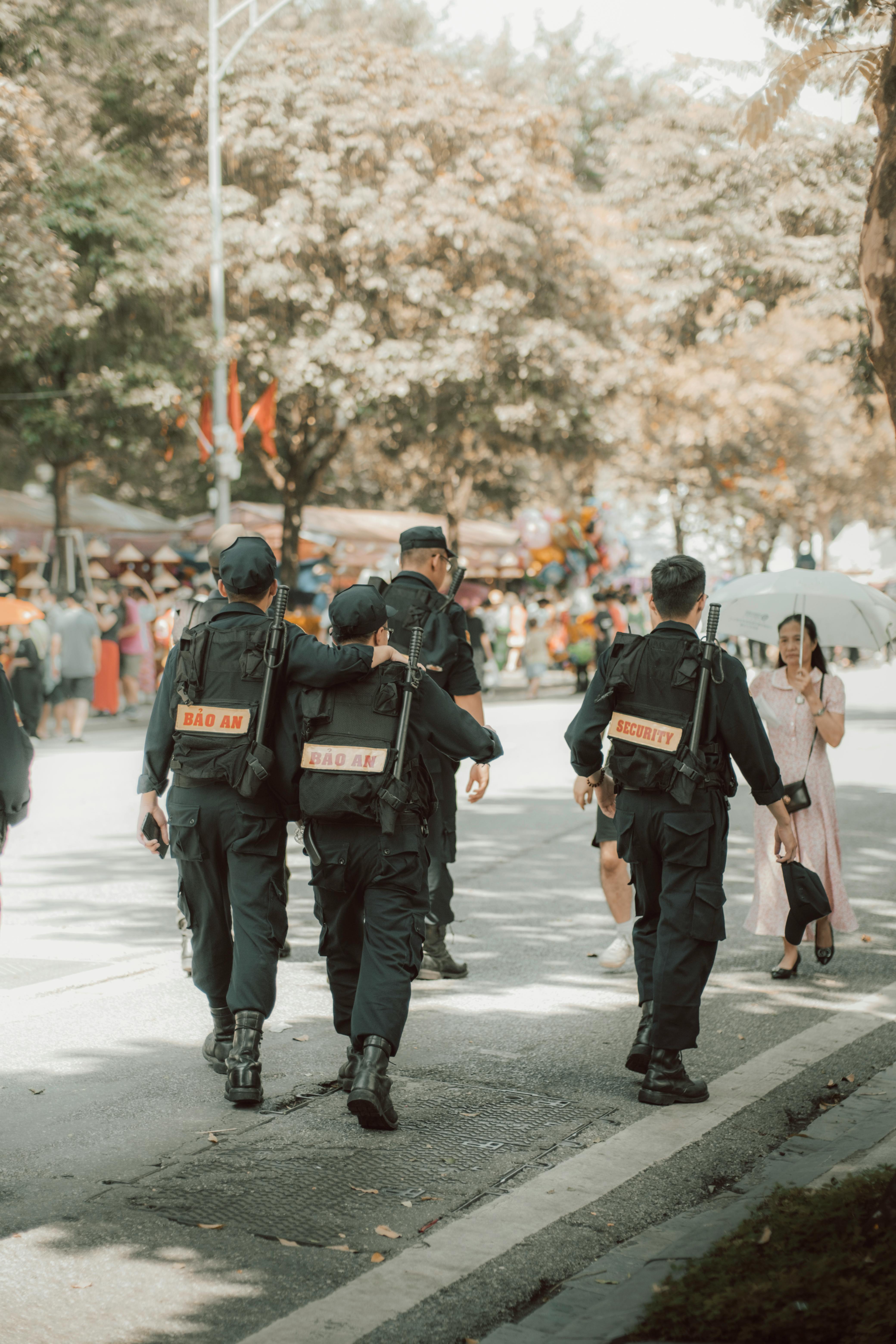 Vietnamese Police Officers Walking Together · Free Stock Photo