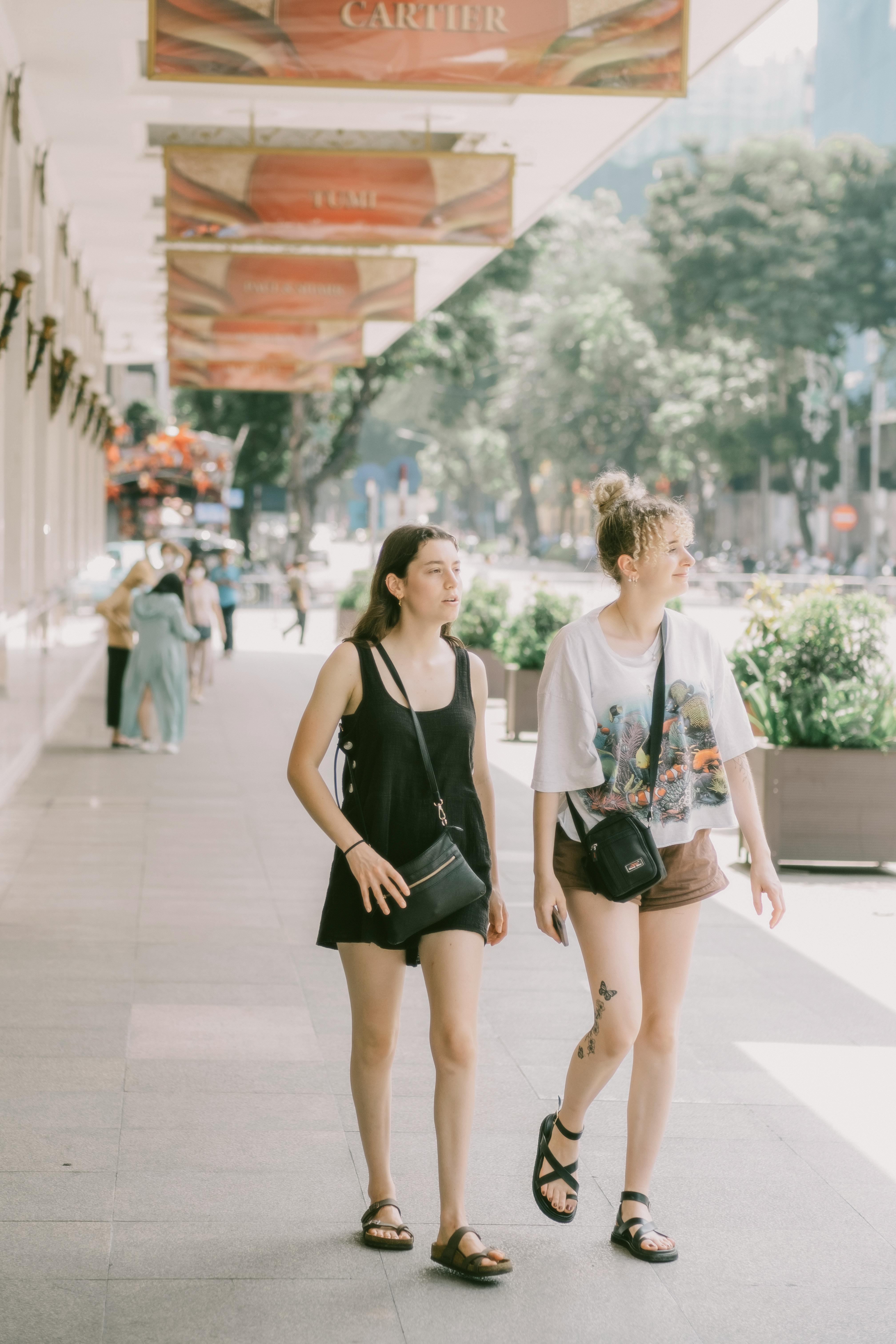 Women Walking on Sidewalk · Free Stock Photo