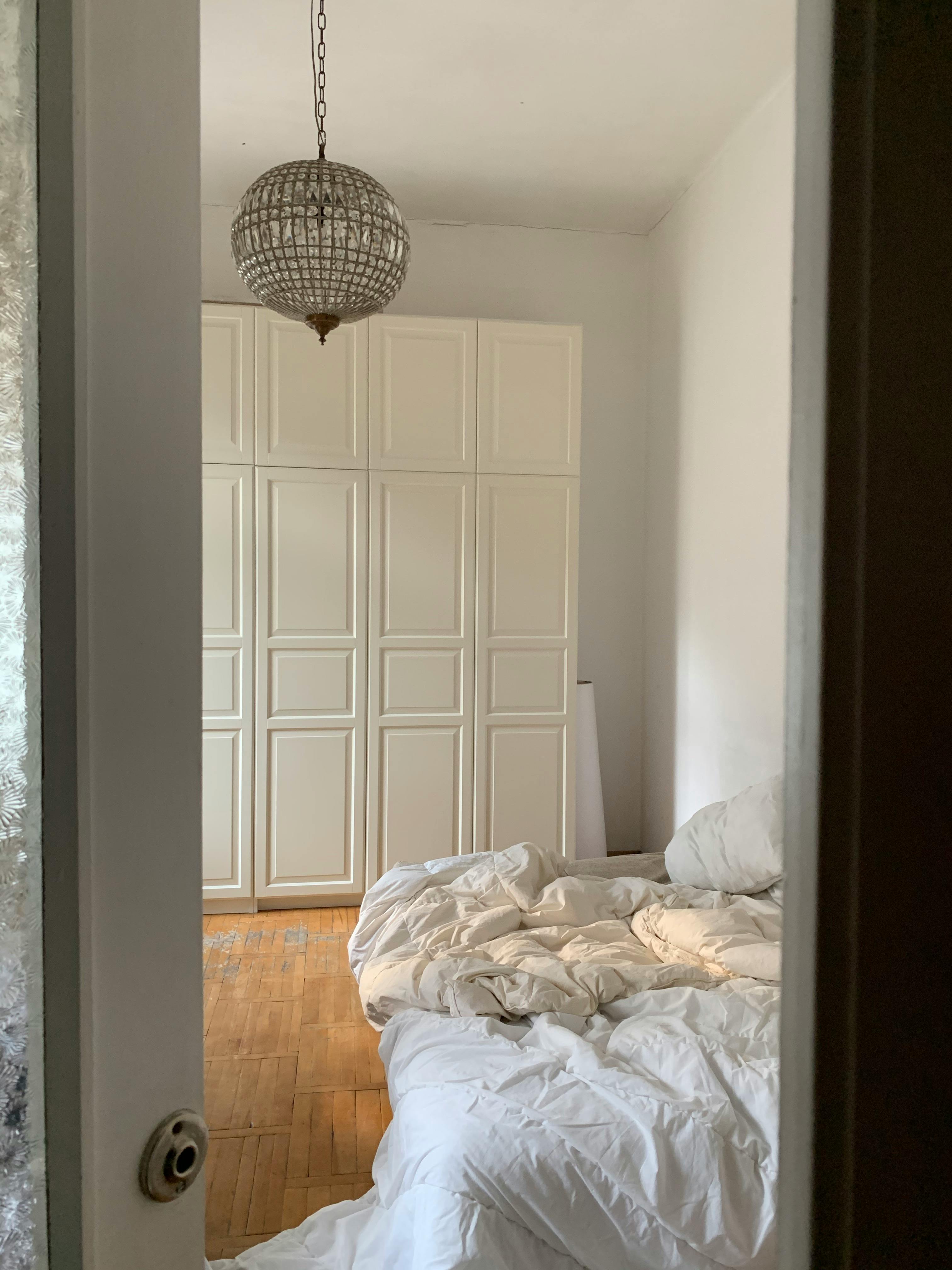 Bedroom with Crumpled Sheets on a Bed · Free Stock Photo