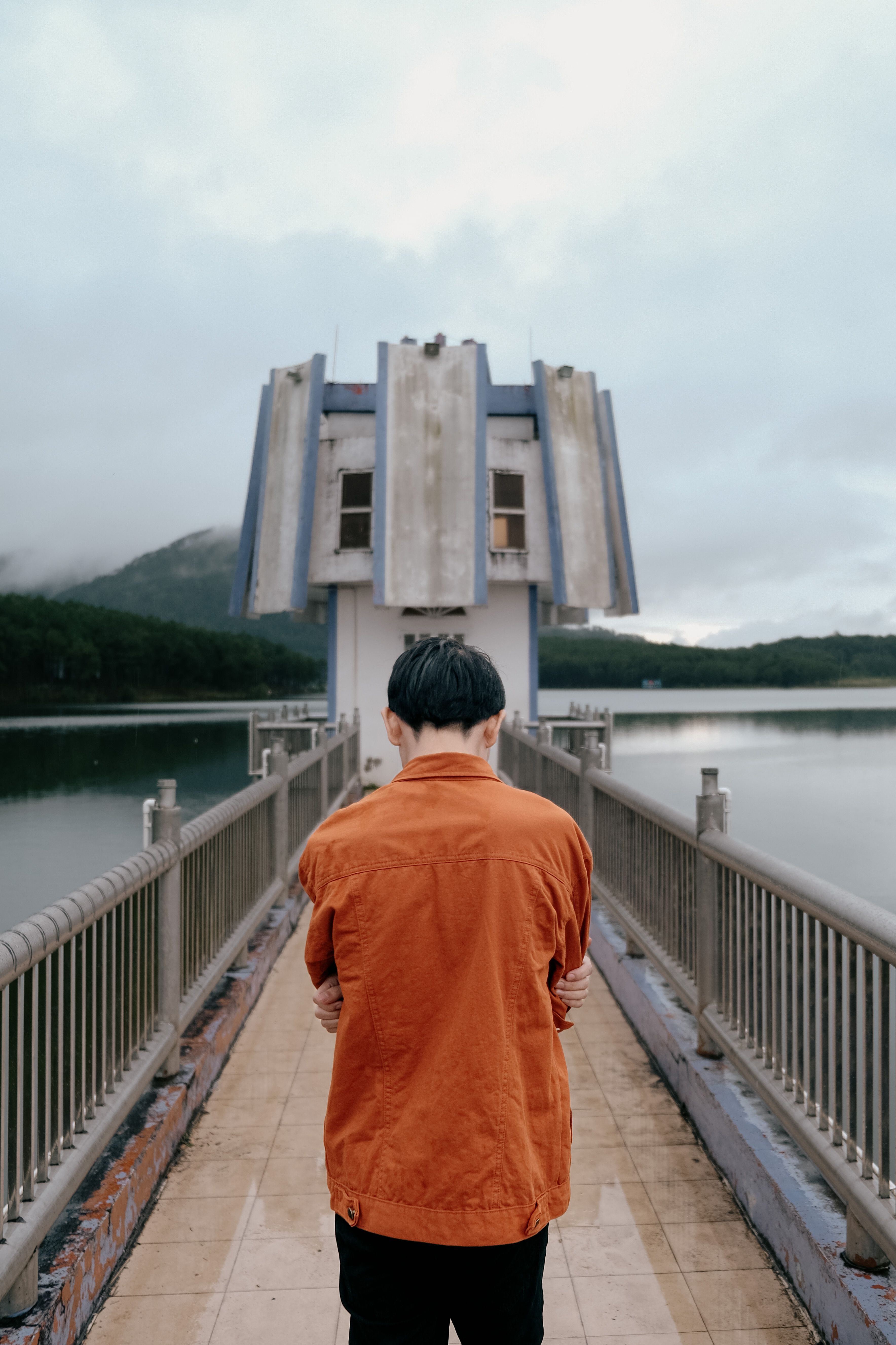 Man Standing on a Bridge · Free Stock Photo