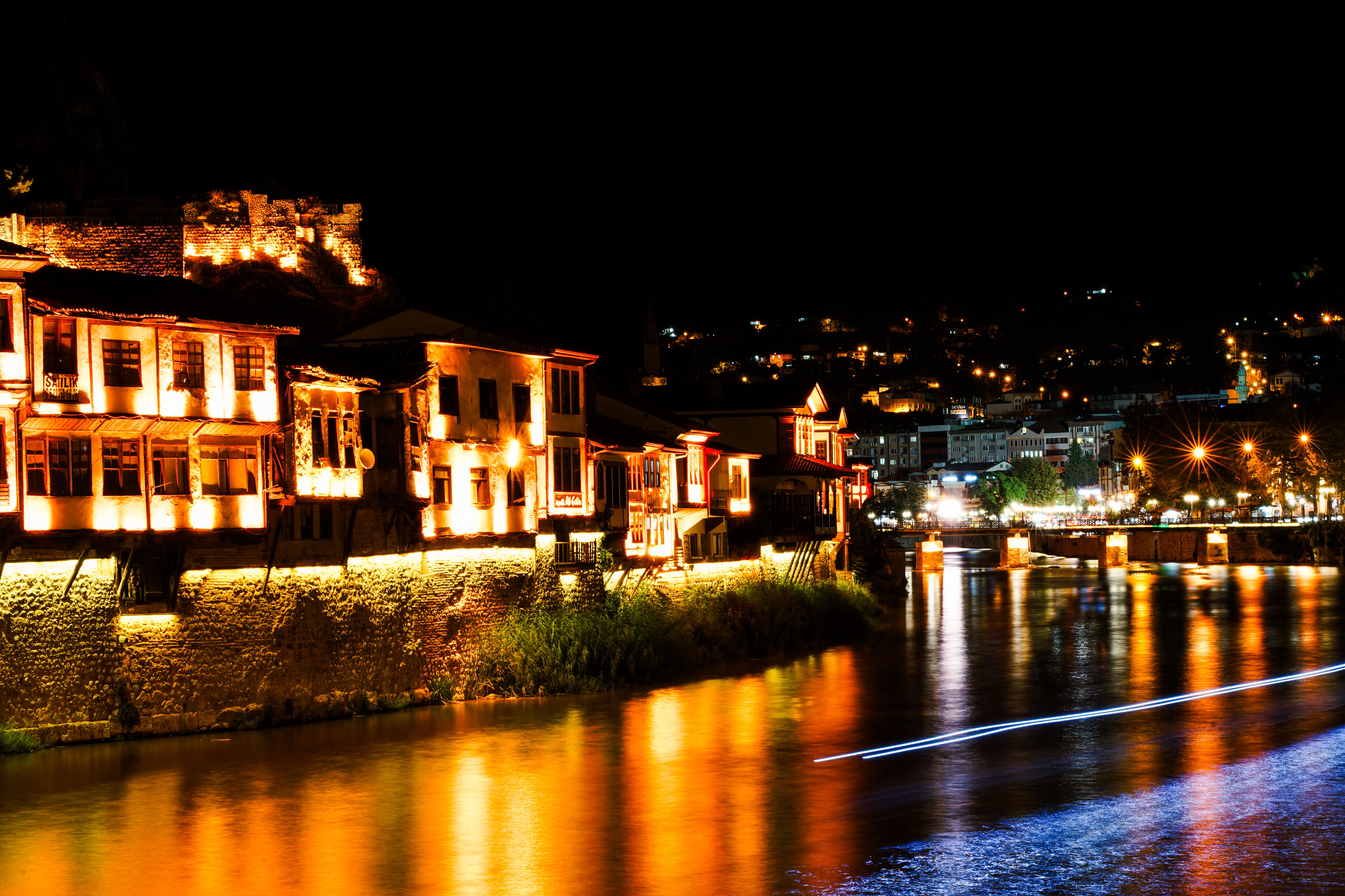 Illuminated Town with River at Night · Free Stock Photo
