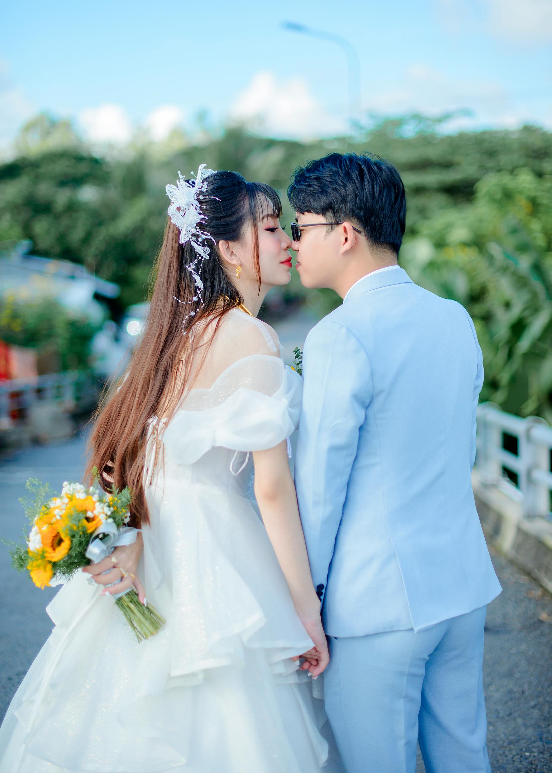 Groom Kissing the Bride on the Forehead · Free Stock Photo