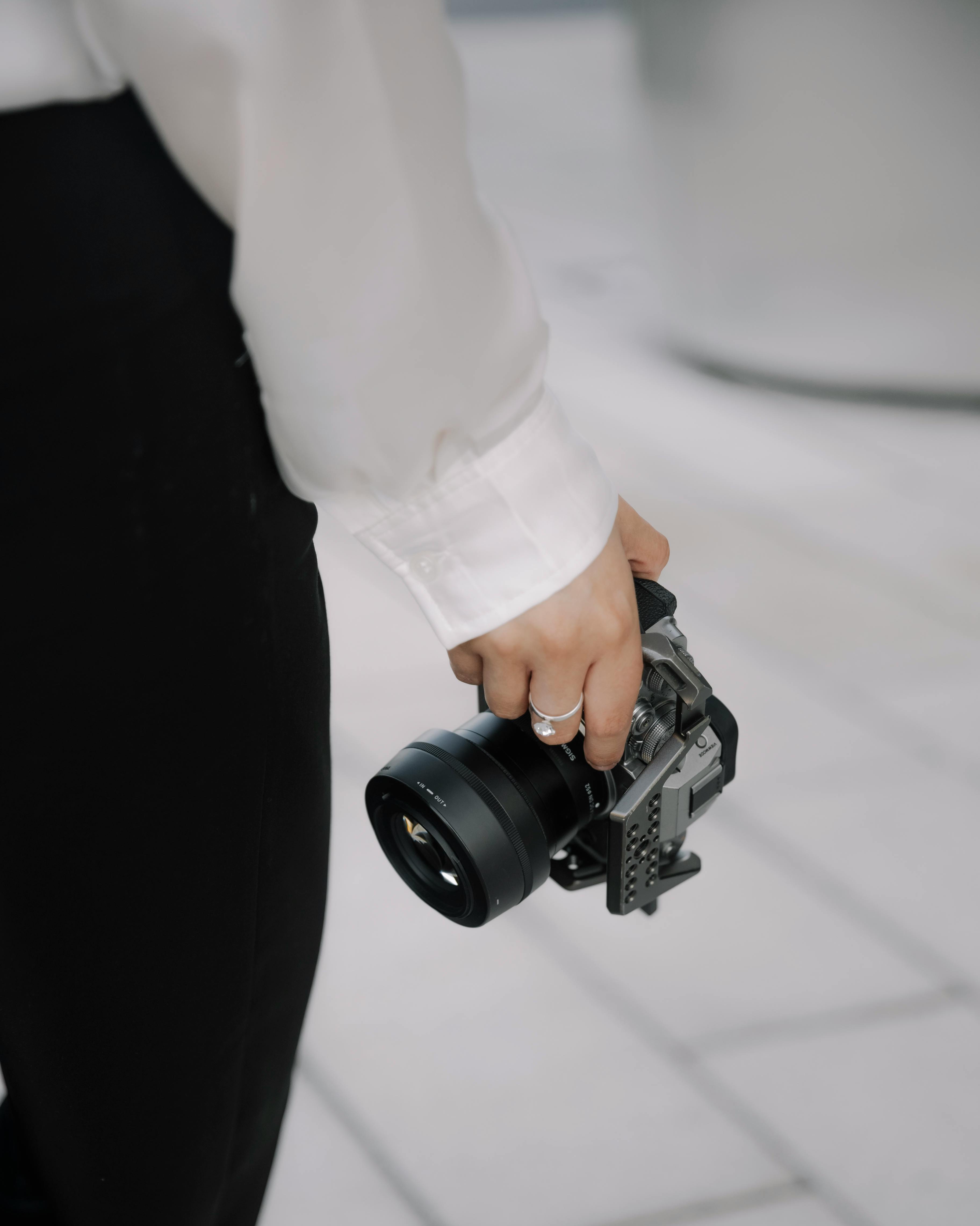 Woman Hand Holding Camera · Free Stock Photo
