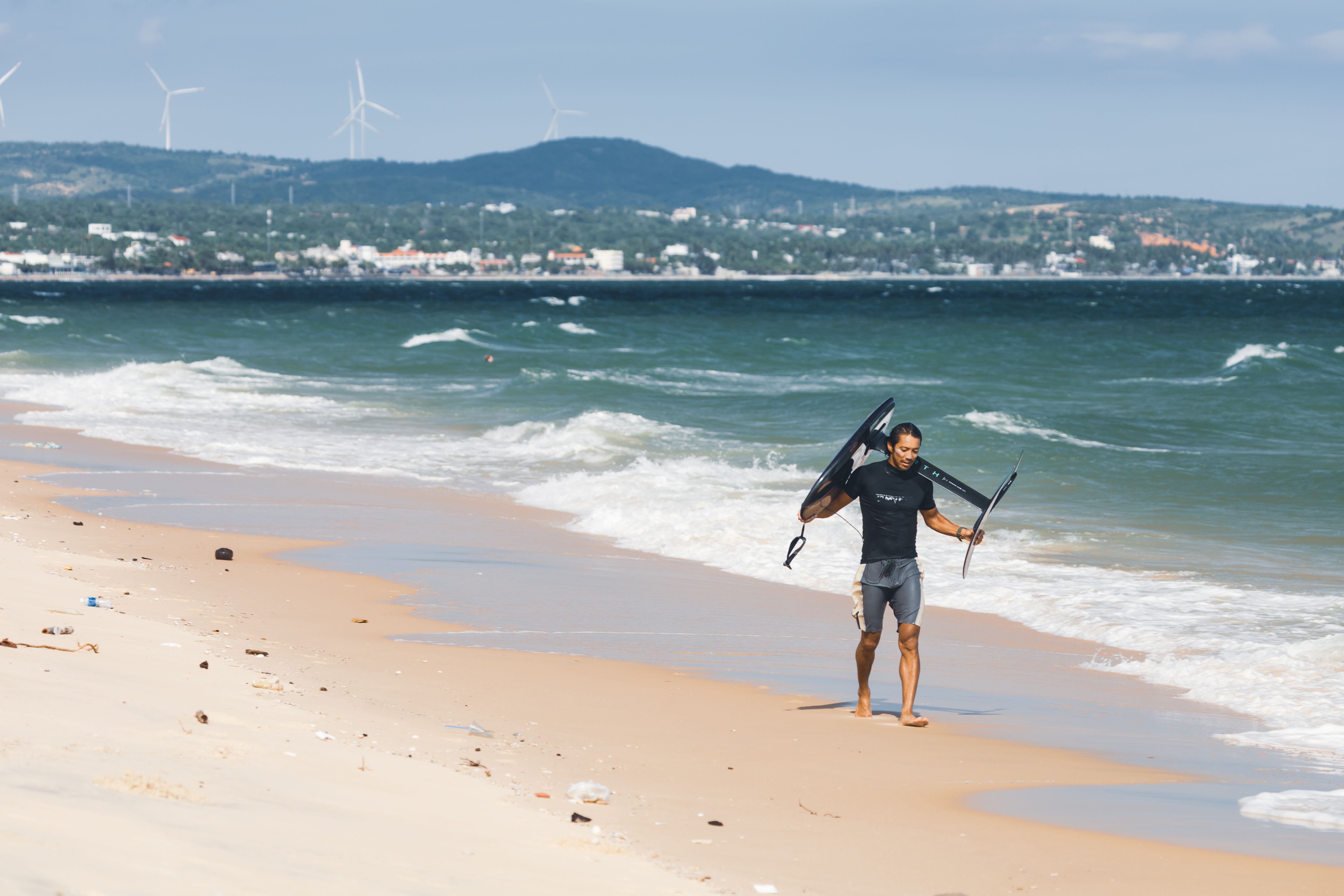 Kitesurfer Carrying Equipment · Free Stock Photo