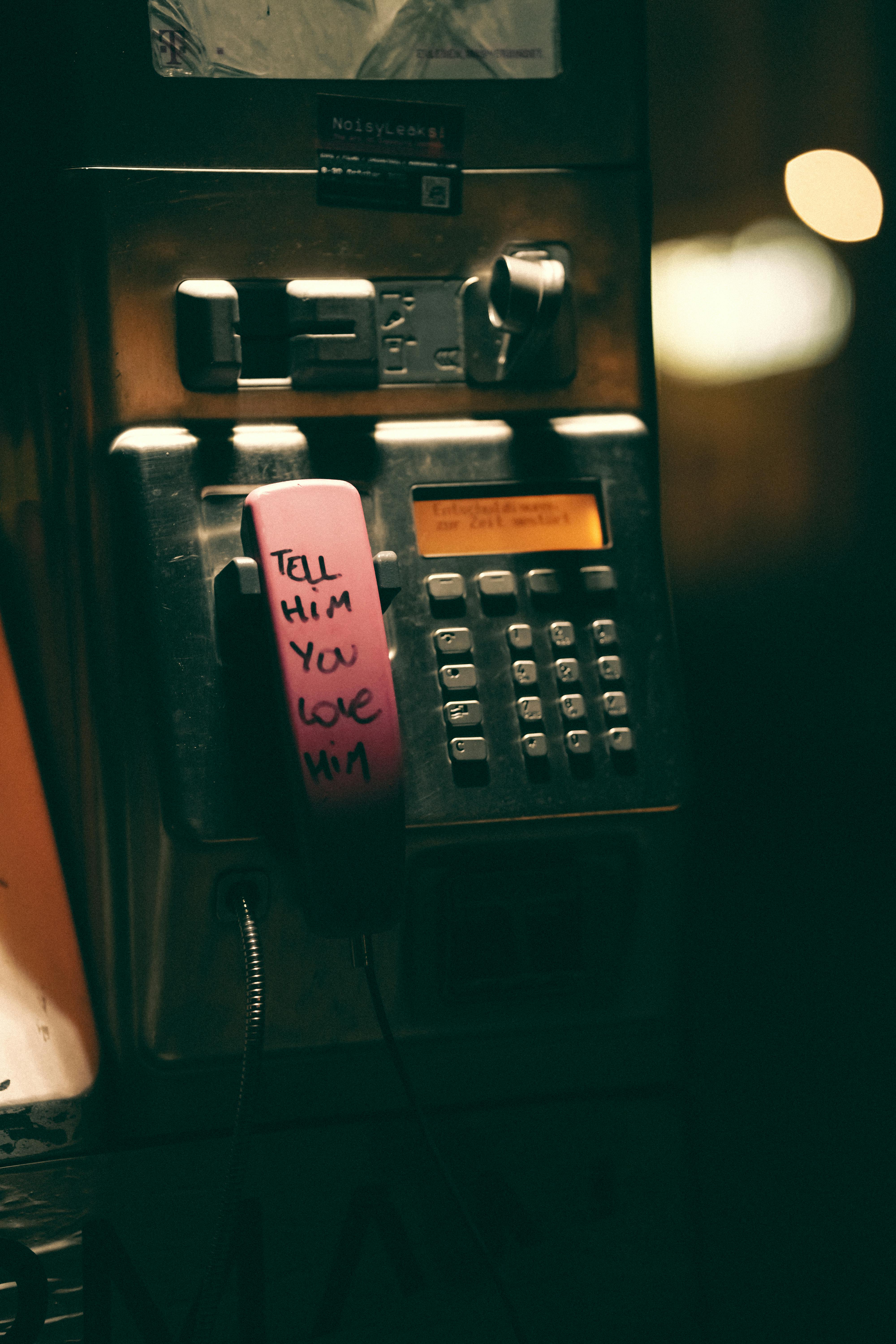 Street Payphone with a Pink Handset · Free Stock Photo