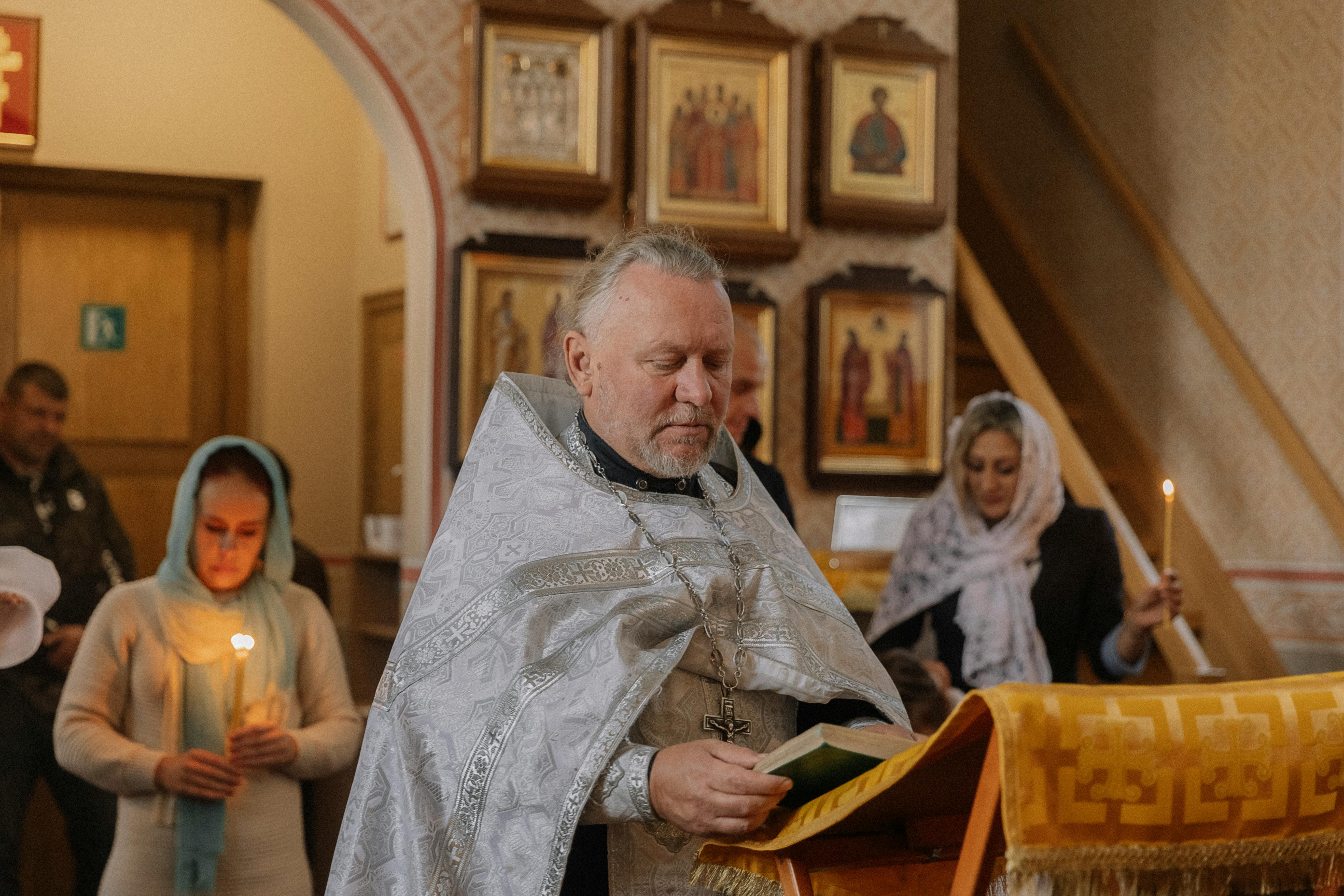 Priest holding a Censer · Free Stock Photo
