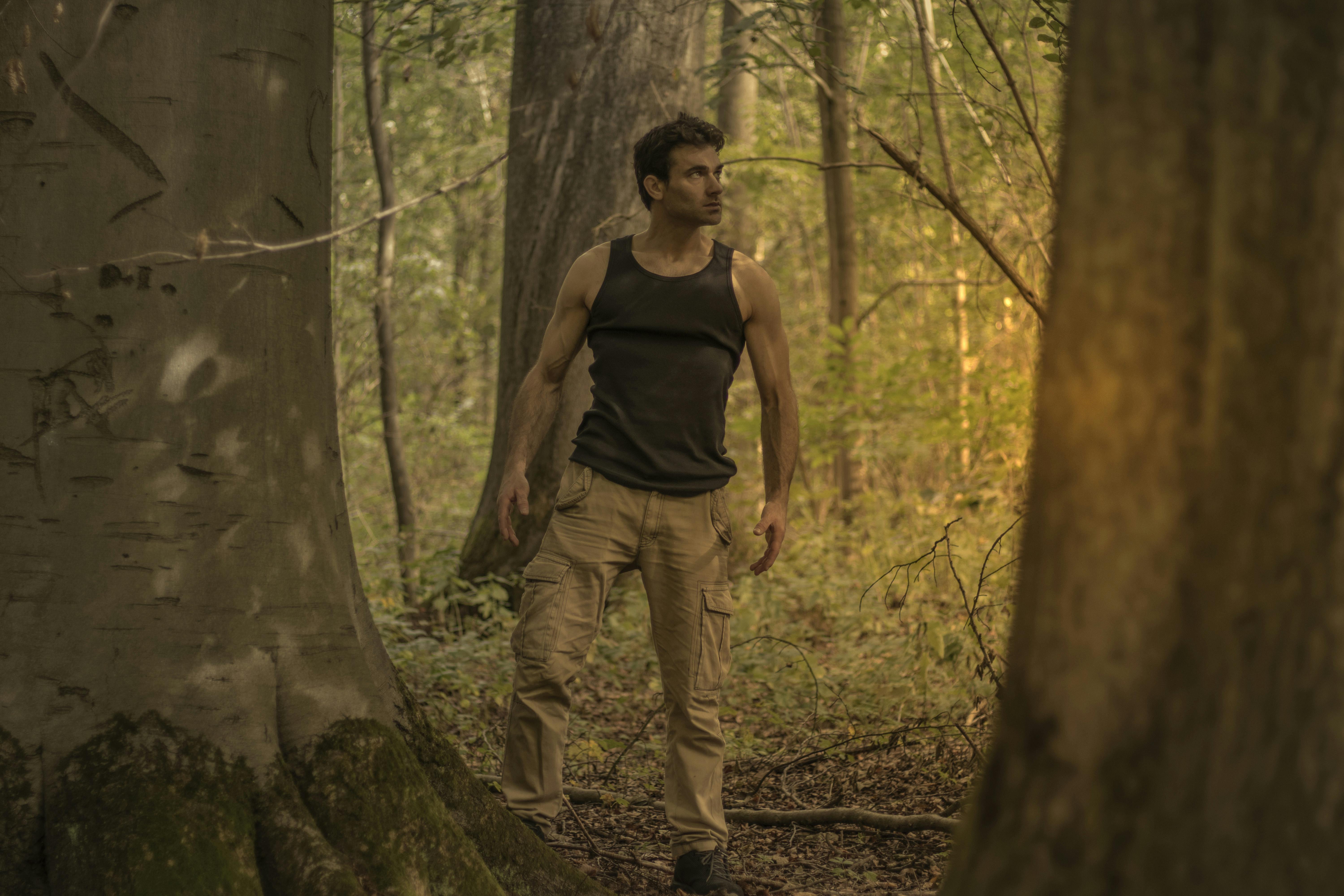 Man Standing in a Forest · Free Stock Photo