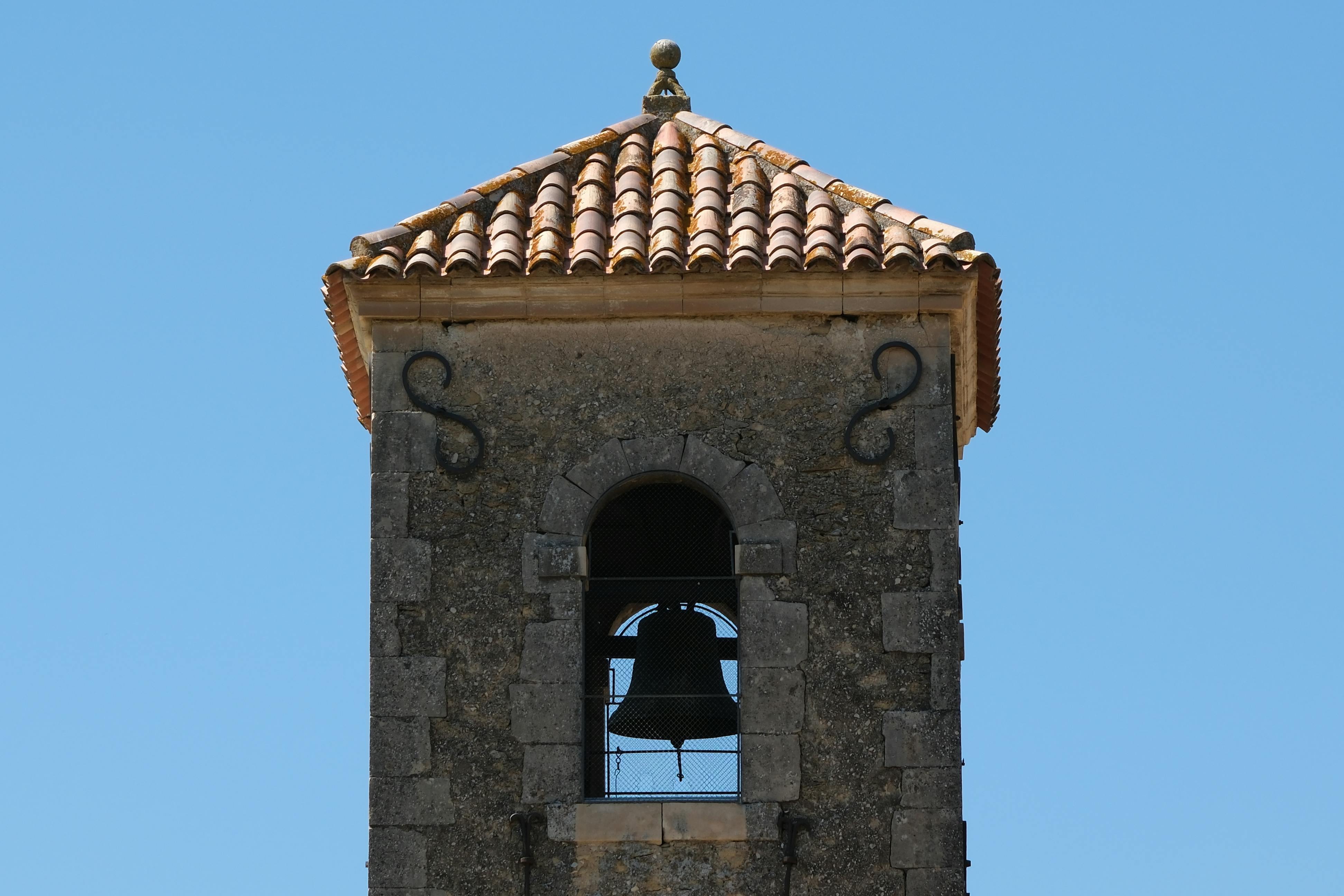 Stone Bell Tower against Blue Sky · Free Stock Photo