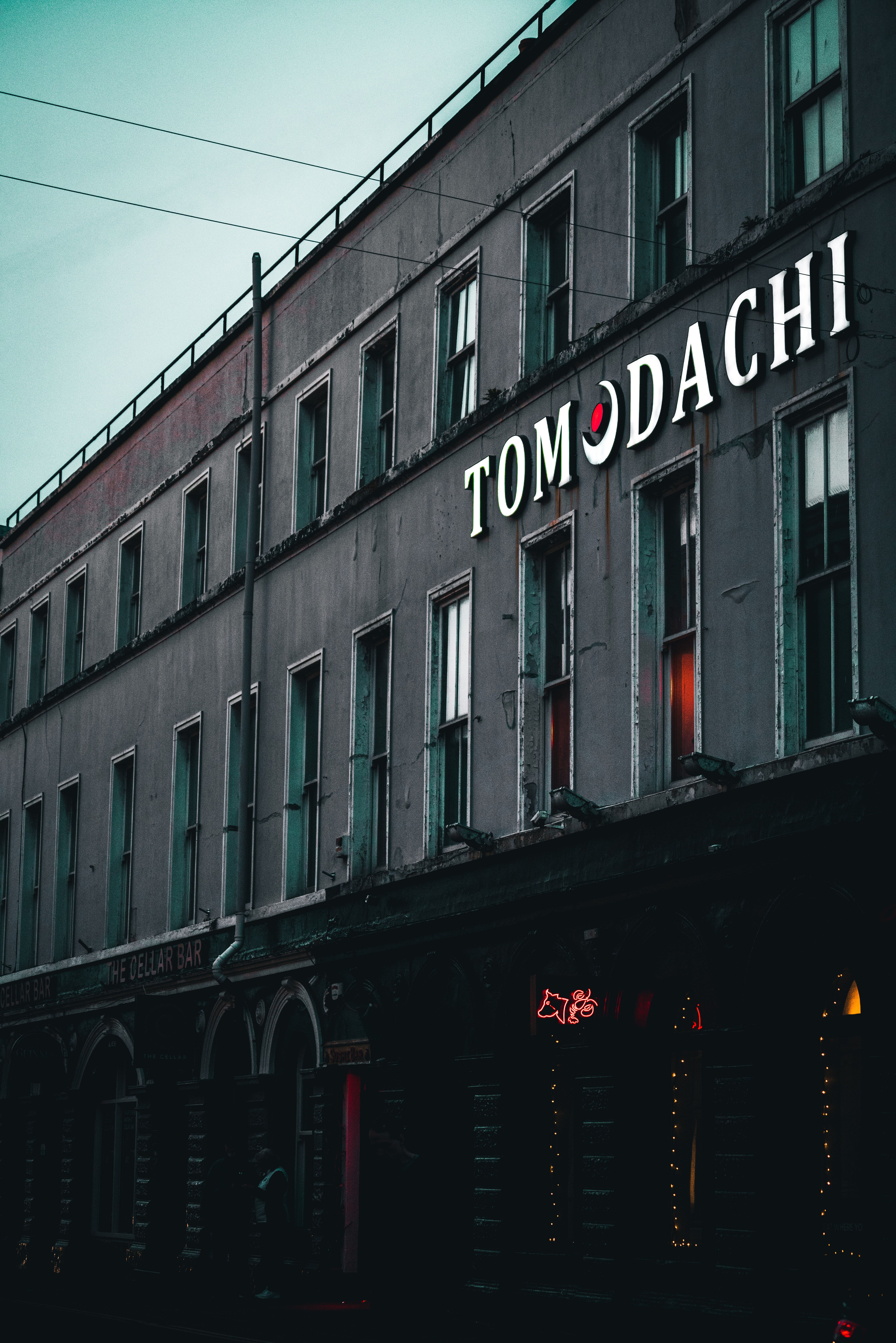 Neon Light Sign on the Side of a Building · Free Stock Photo