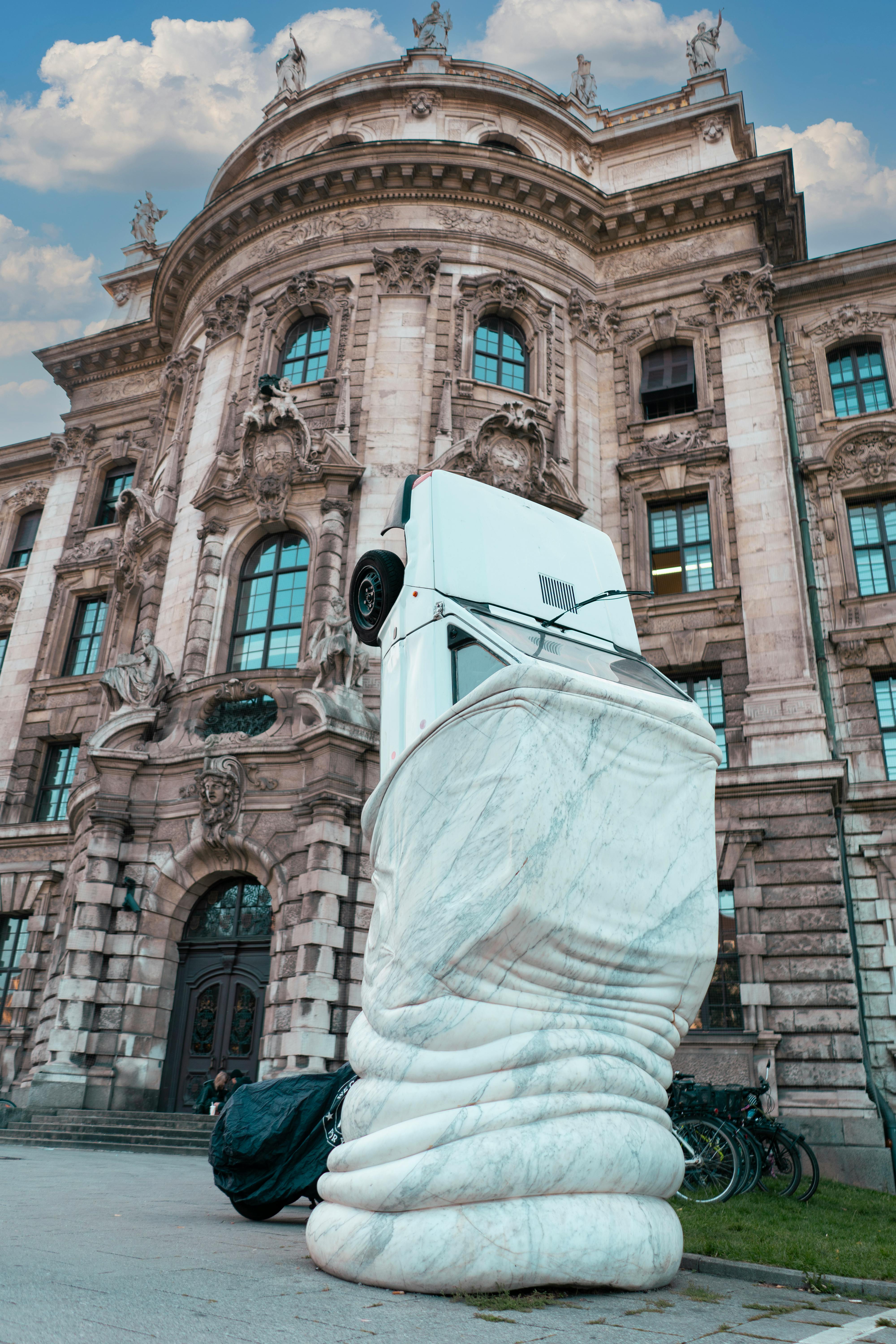 Autoeater Sculpture Next to the Building of District Court Munich I in Germany · Free Stock Photo