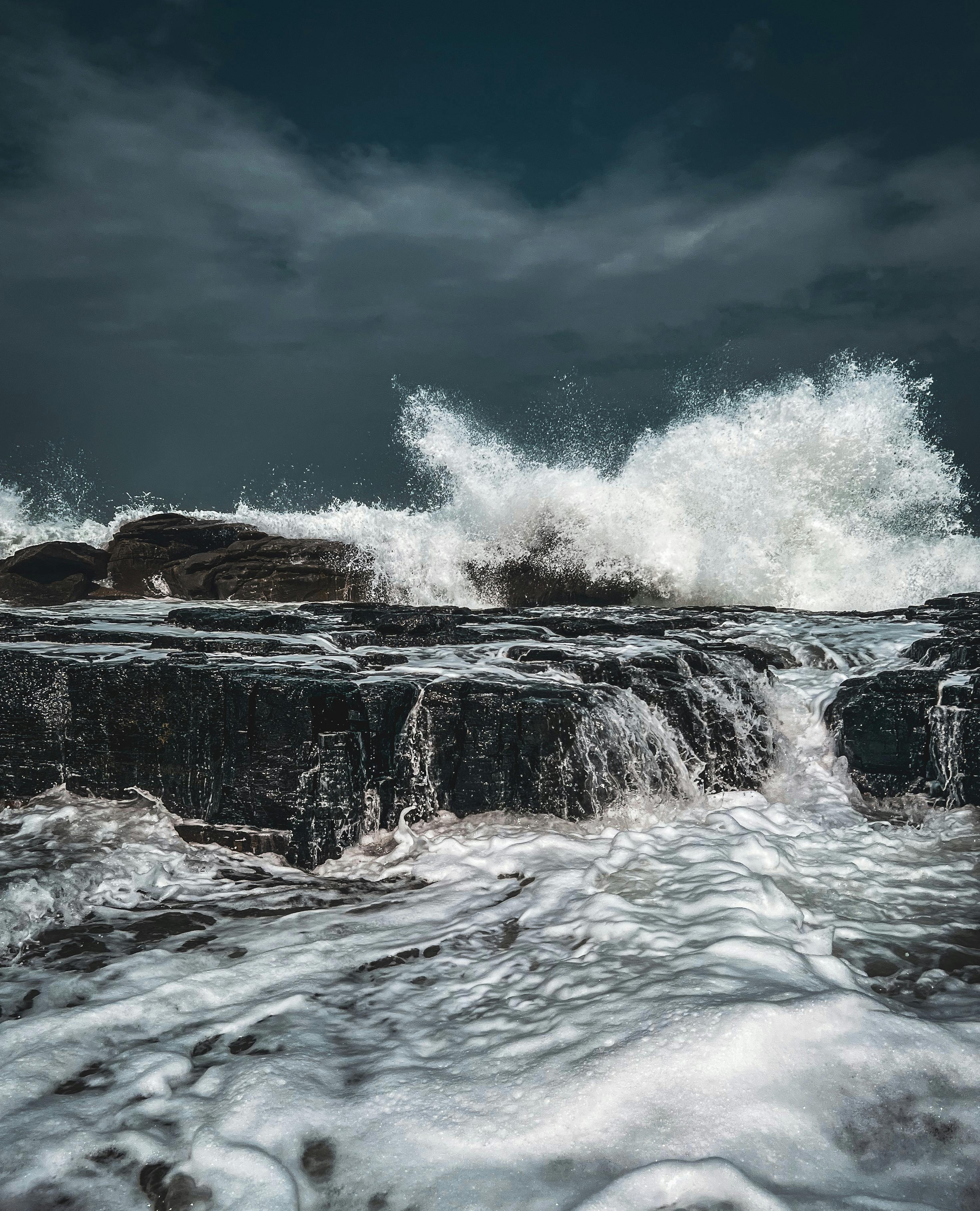 Splashing Sea Waves under Storm Clouds · Free Stock Photo
