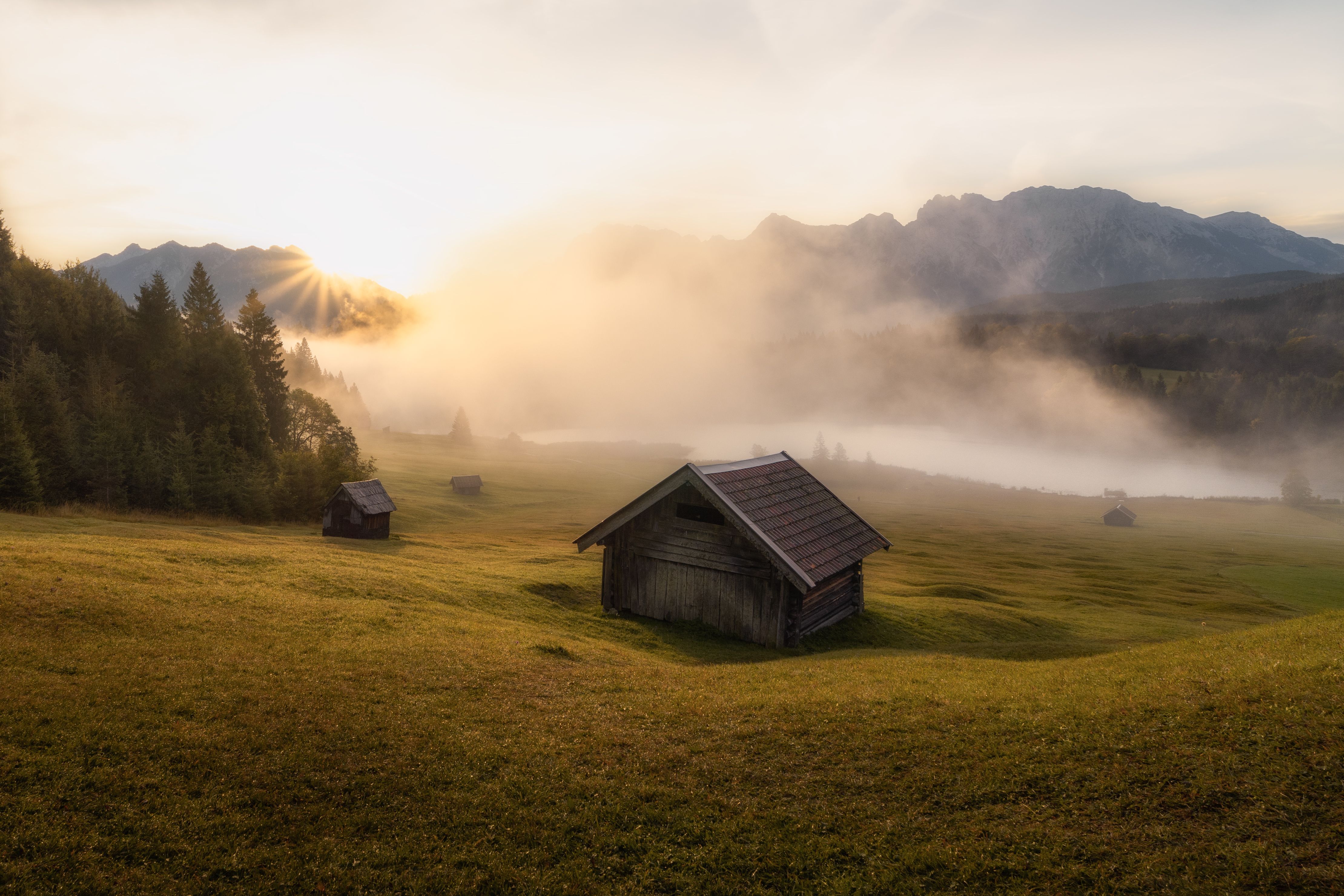 Sunset Sunlight over Buildings on Grassland · Free Stock Photo