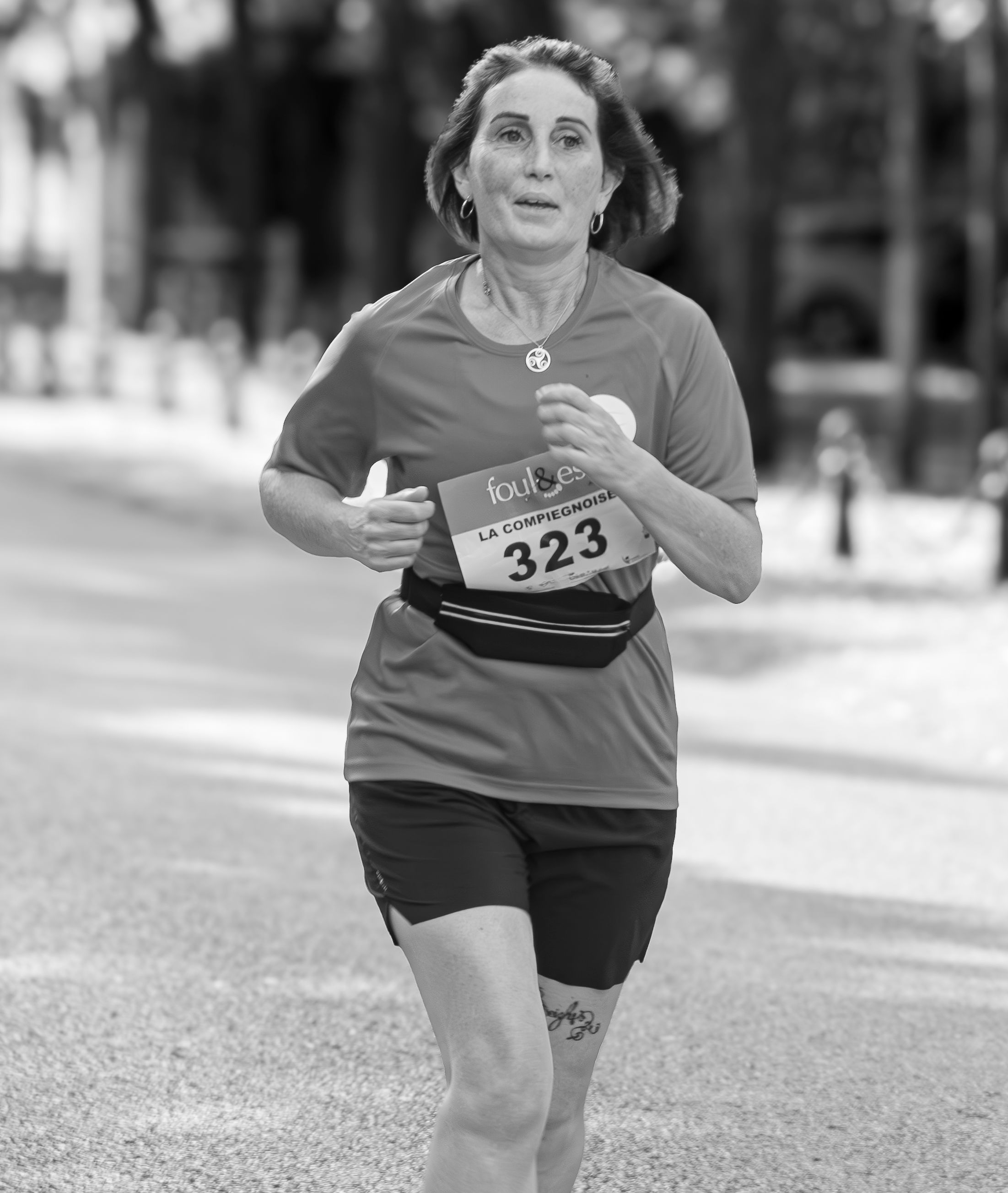 Woman Running through City in Marathon · Free Stock Photo