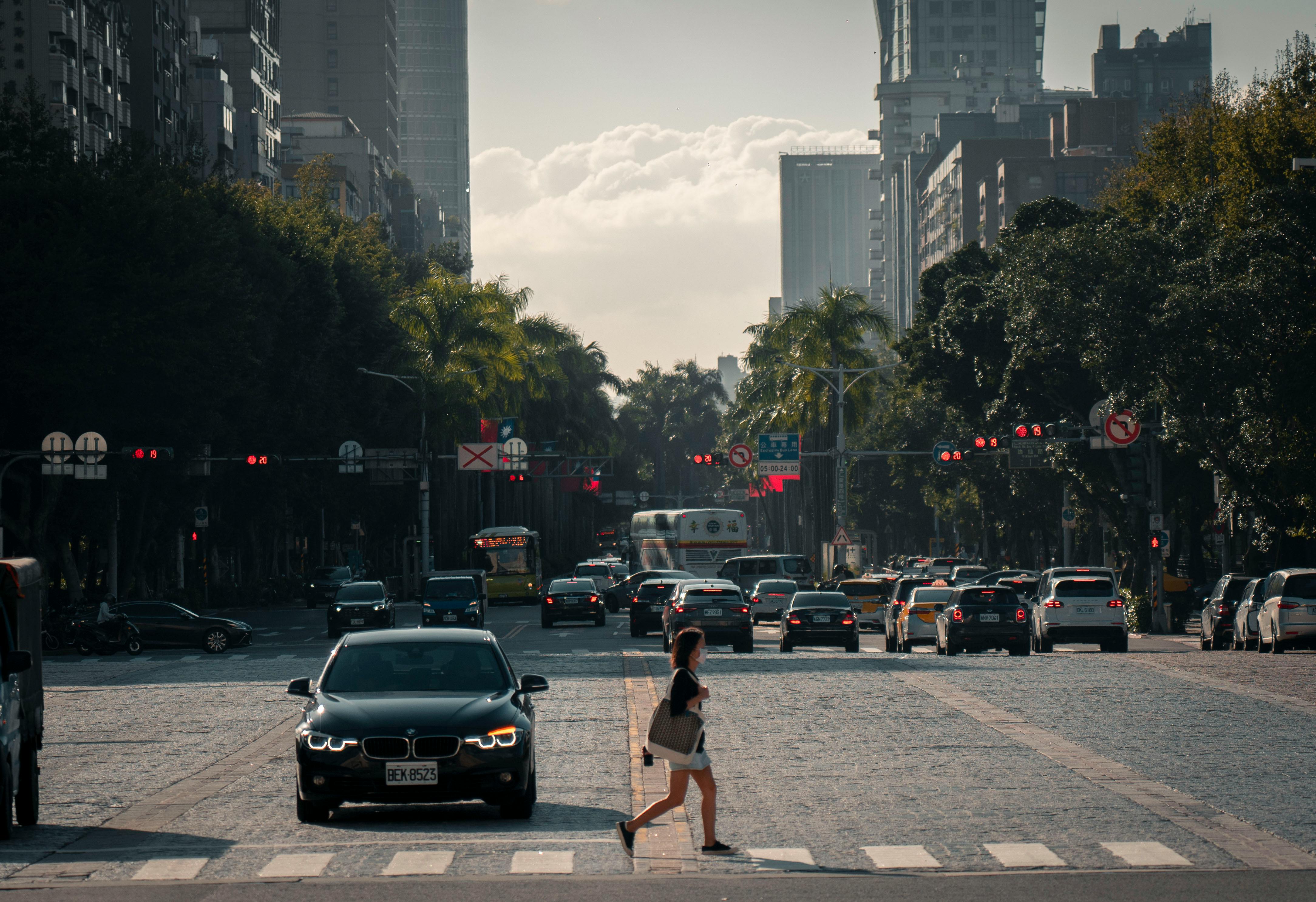 Woman Crossing Street in City · Free Stock Photo