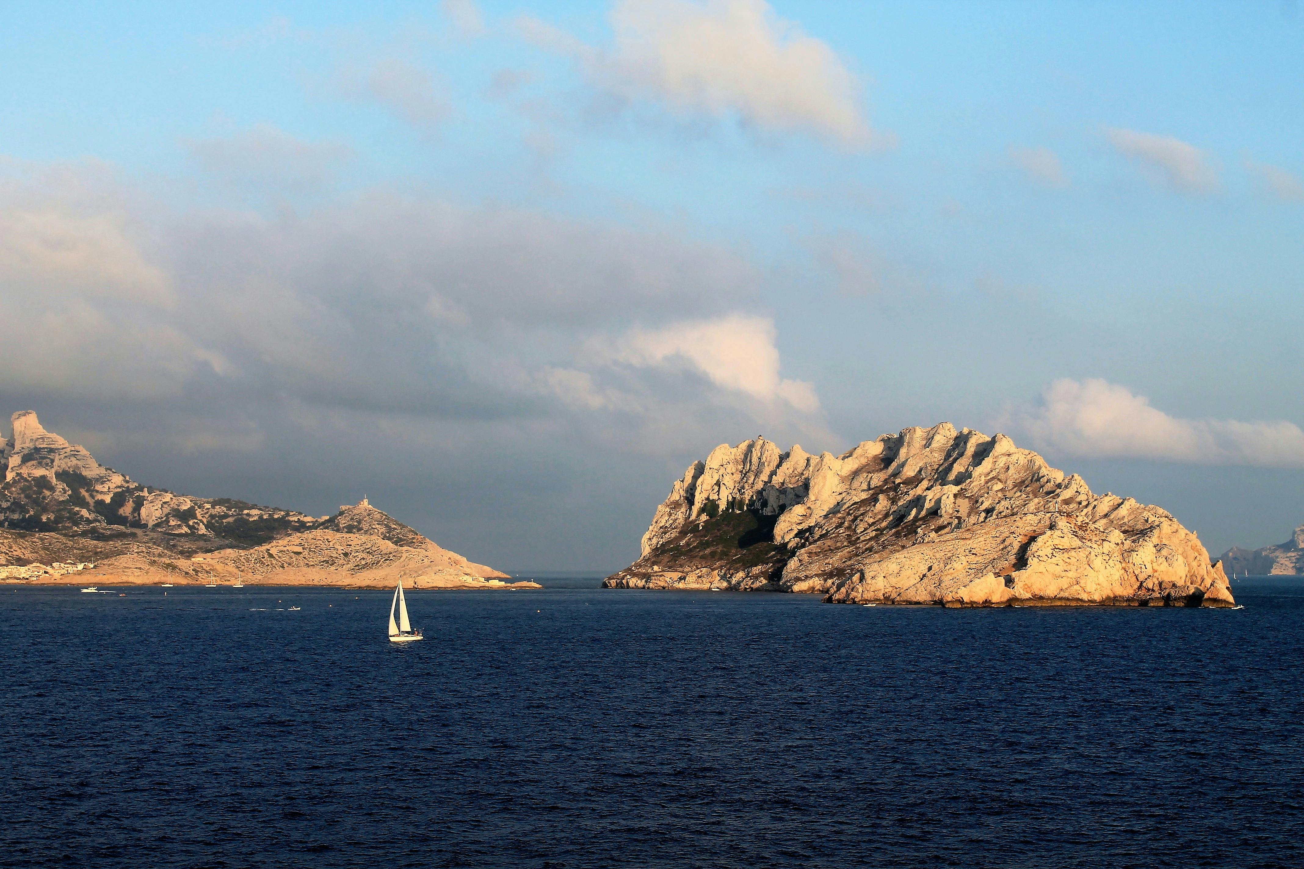 Sailboat on Calm Seashore · Free Stock Photo