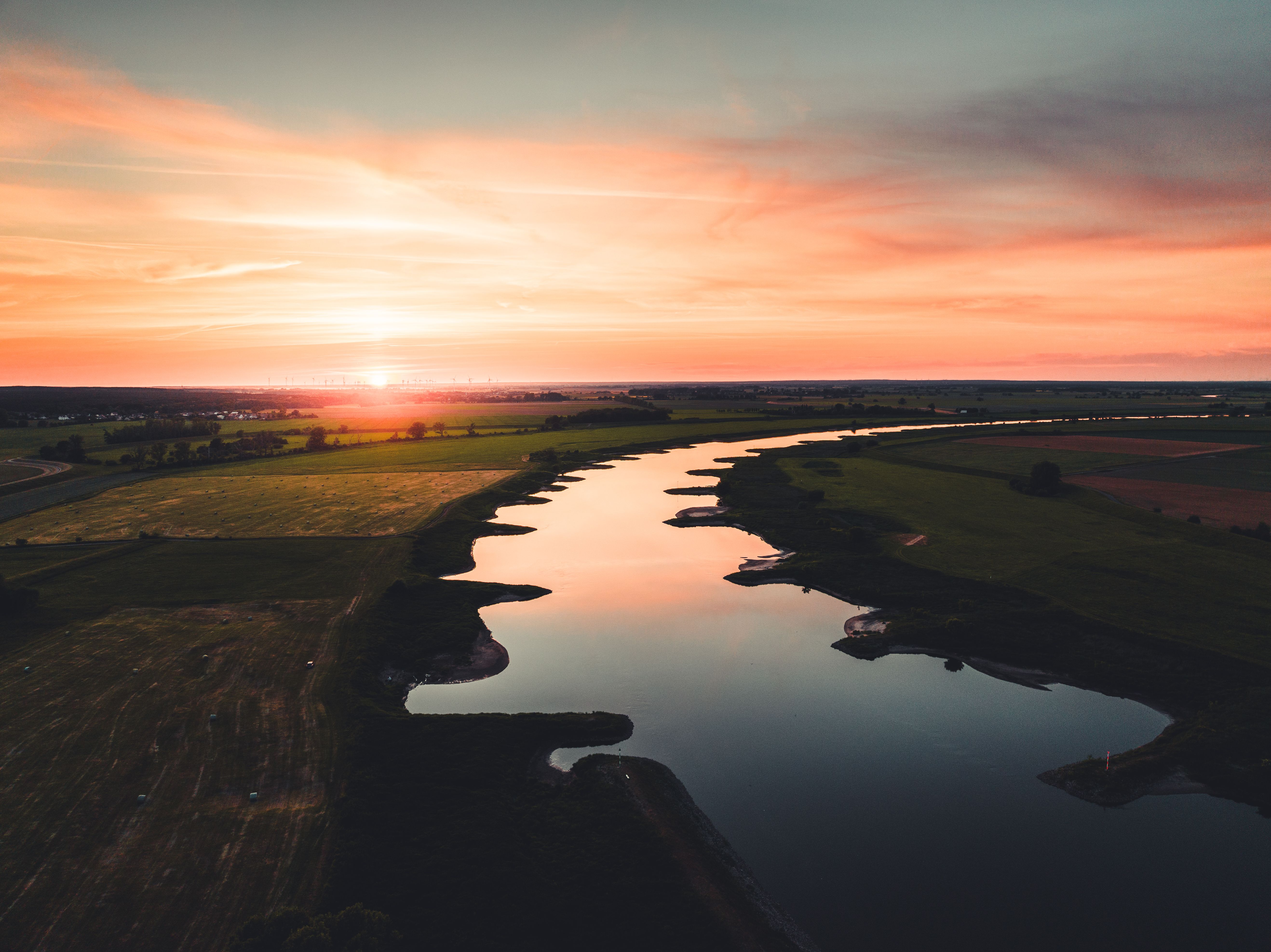 Sunset over River on Plains · Free Stock Photo
