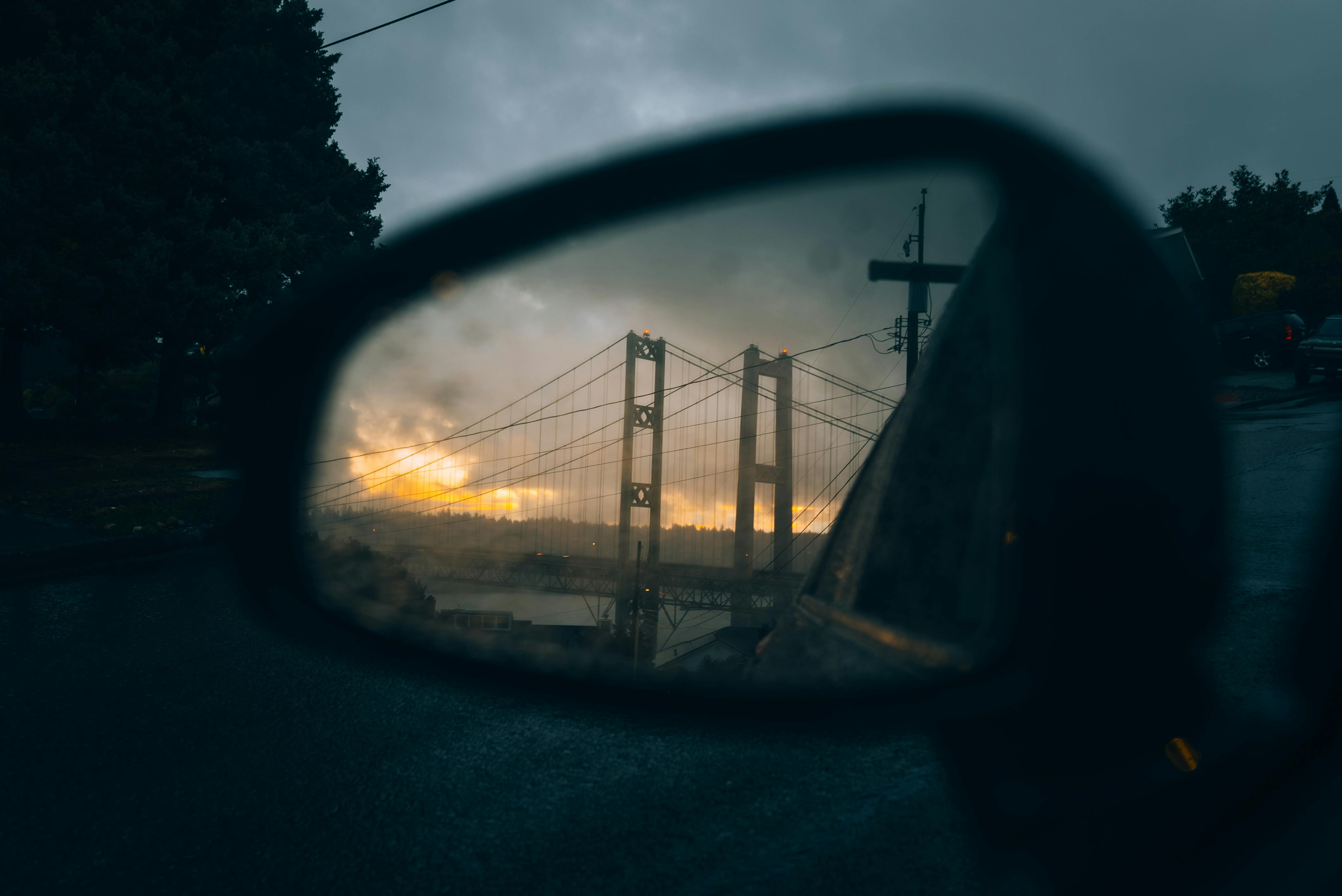 Suspension Bridge Seen in a Car Mirror · Free Stock Photo