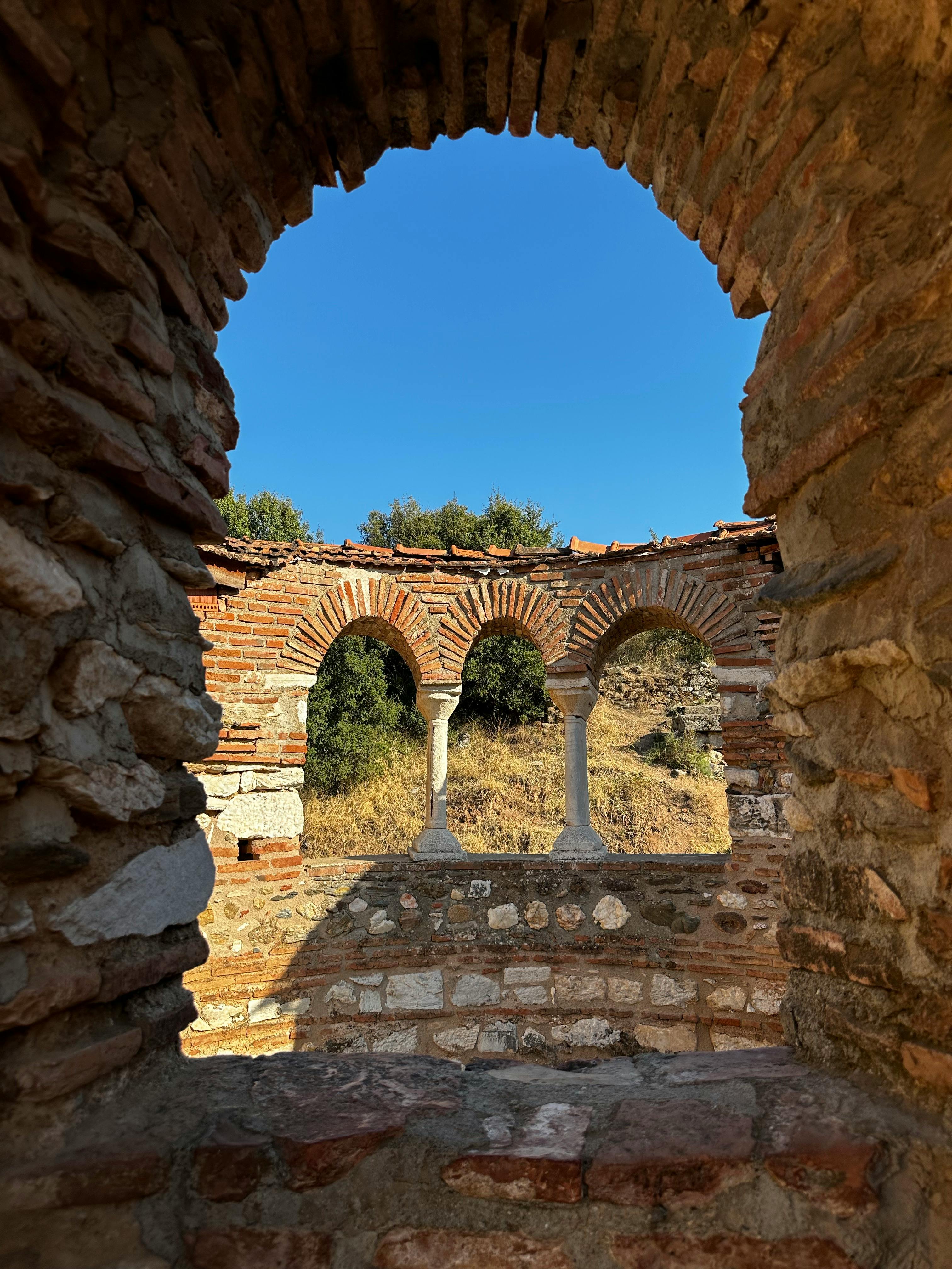 Photographer Capturing Inside Ruins · Free Stock Photo
