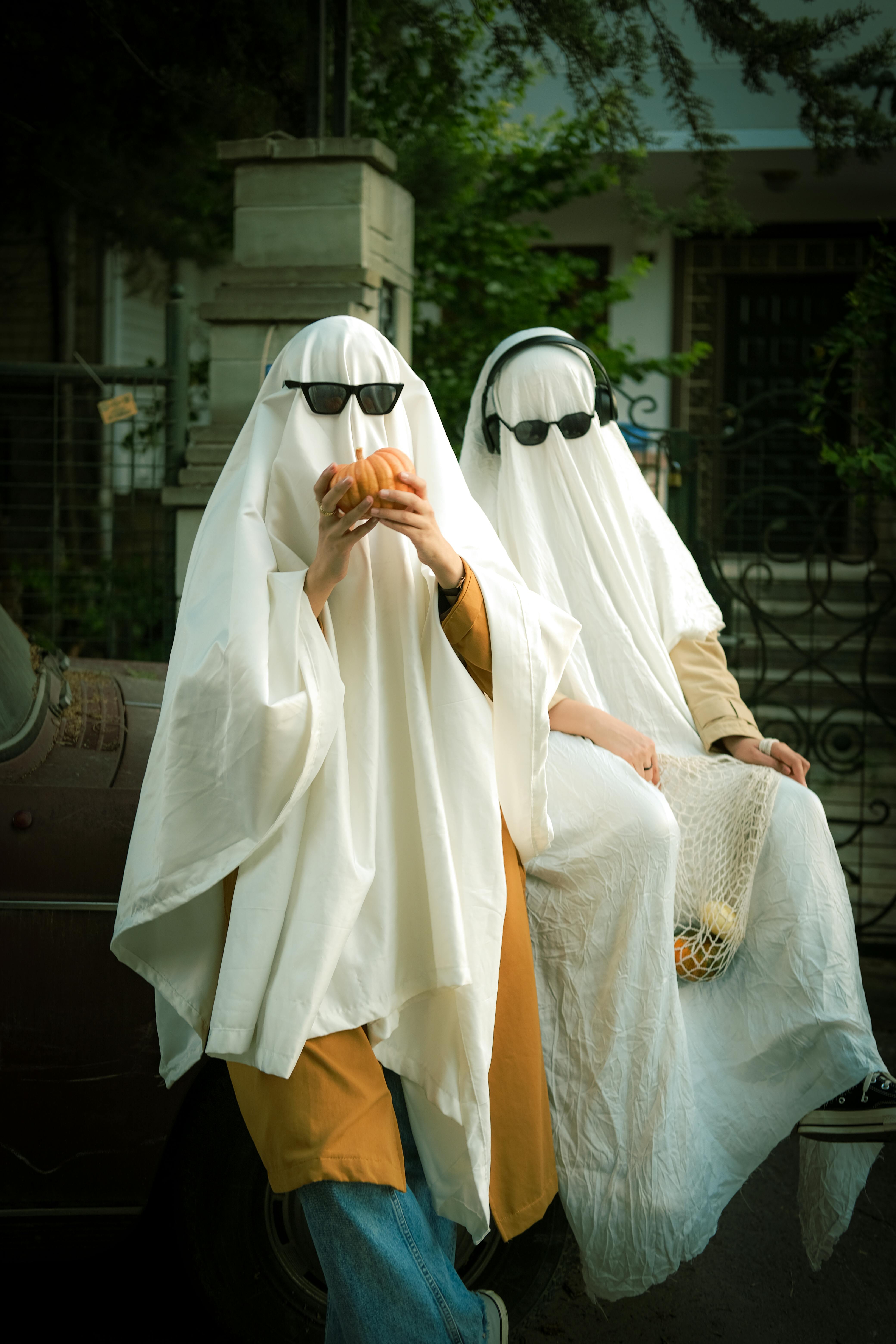 People in Ghosts Costumes Celebrating Halloween · Free Stock Photo