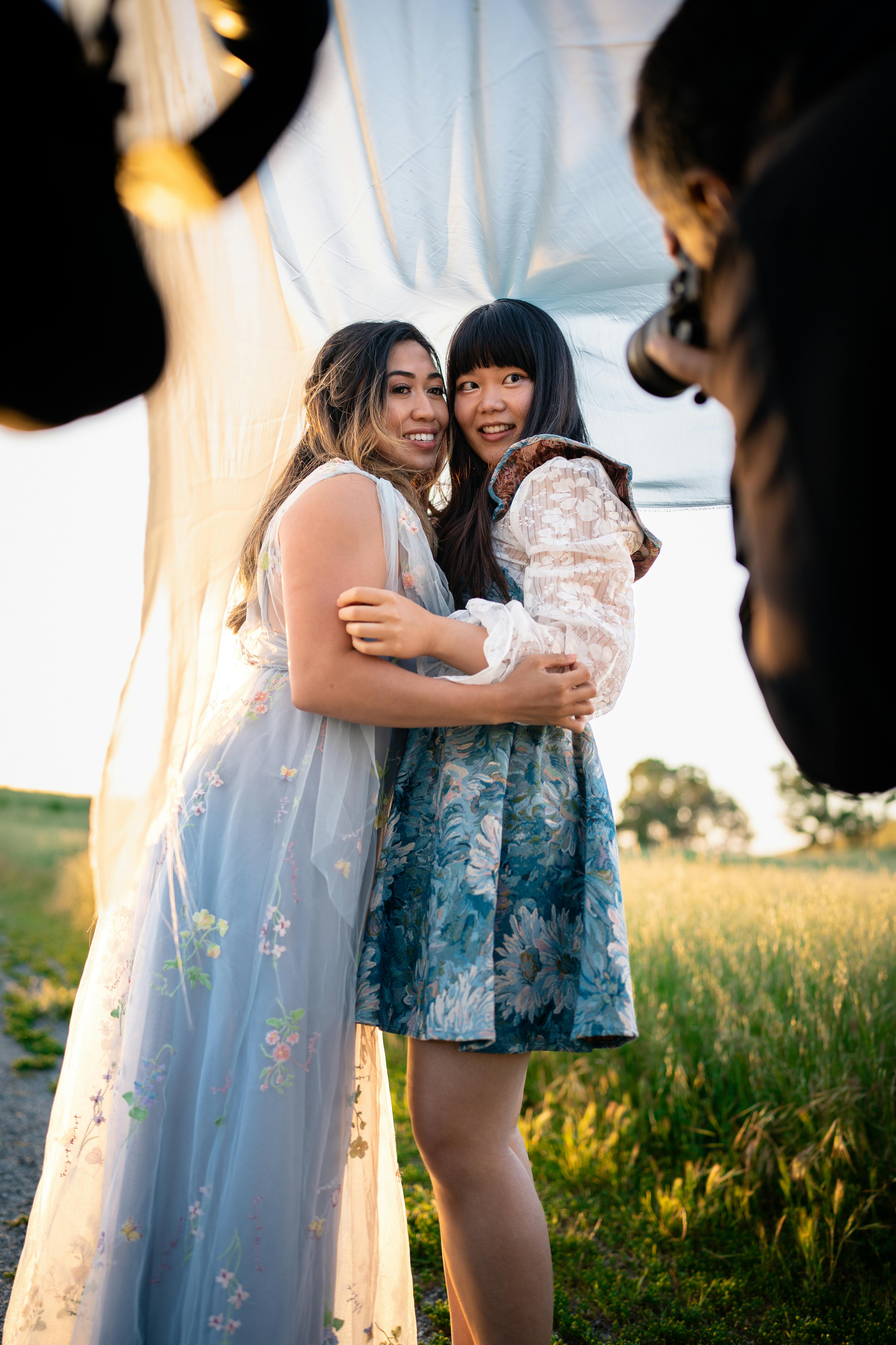 Woman Photographing Man in Jeans in Seaside · Free Stock Photo