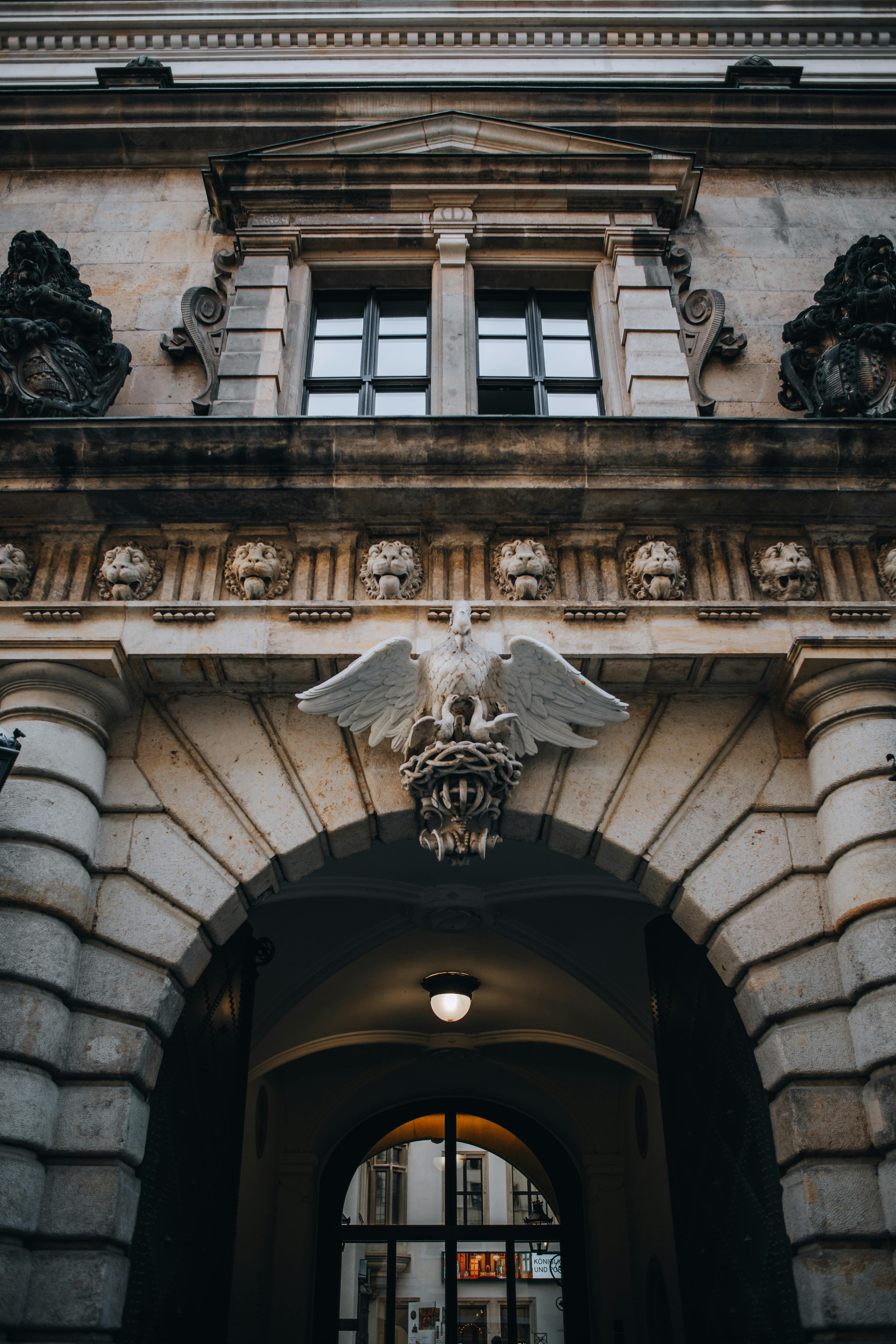 Eagle Sculpture on Building Wall · Free Stock Photo