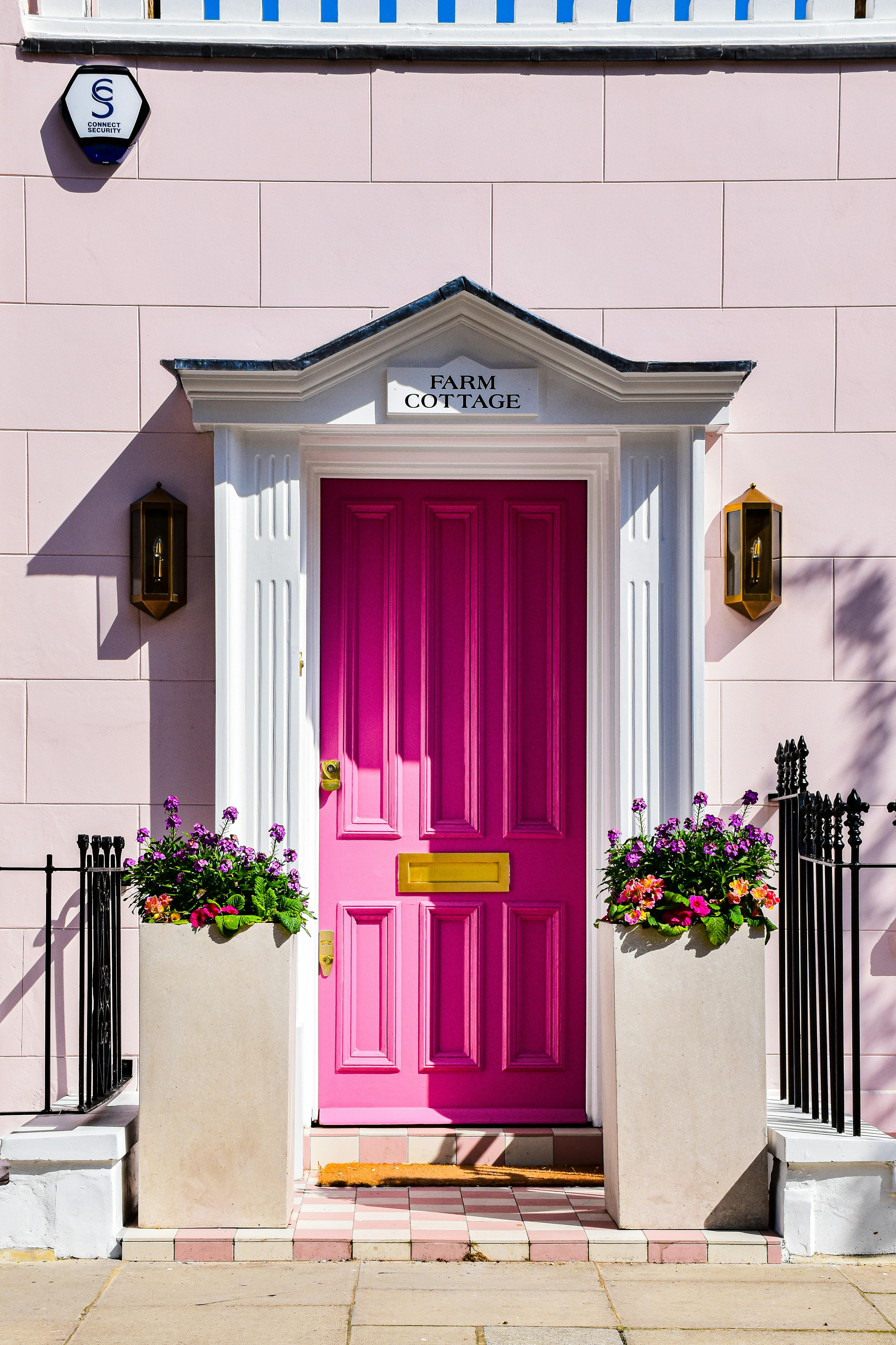 Facade of a Townhouse with Pink Entrance Door · Free Stock Photo