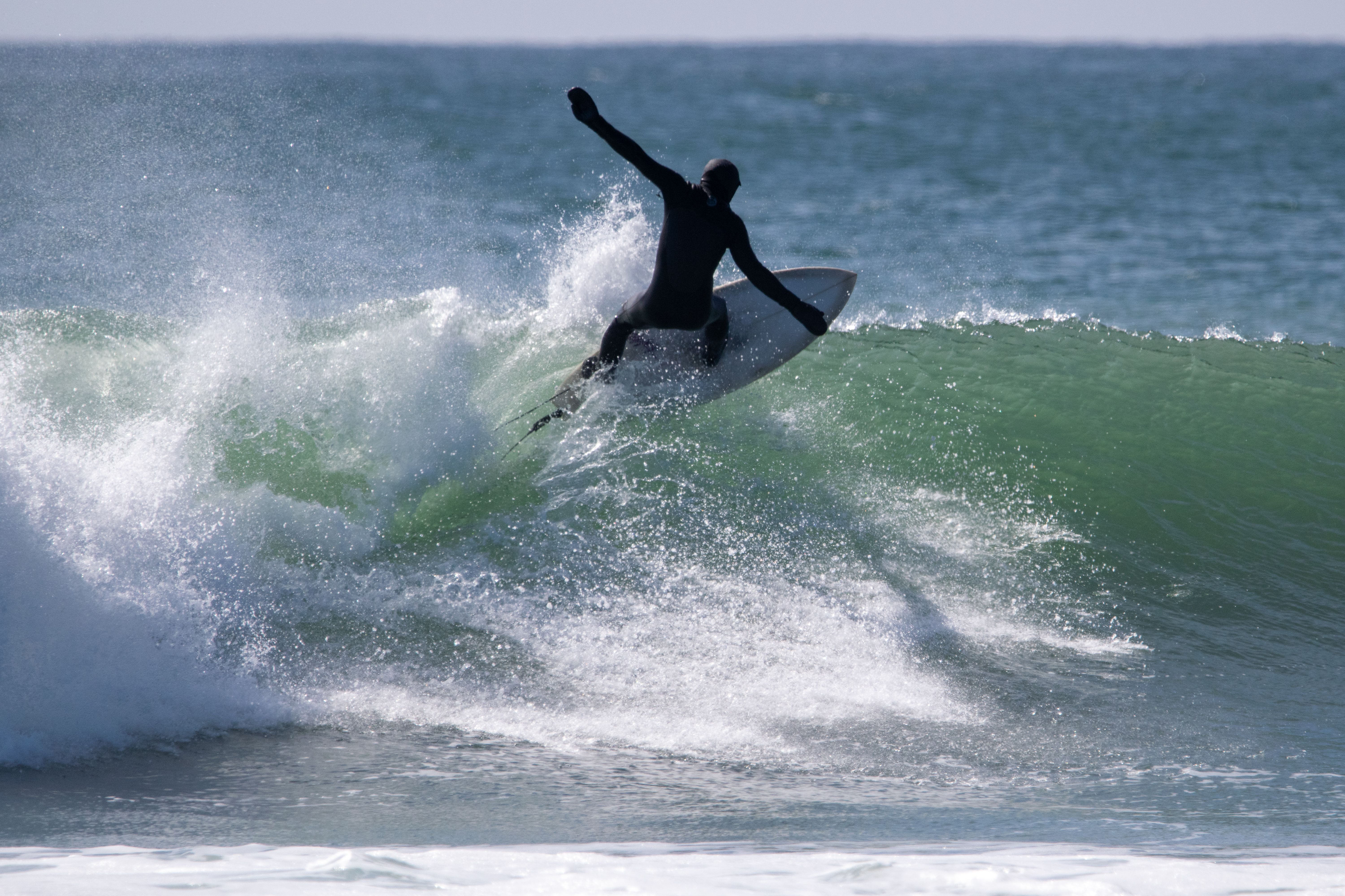 Aerial View Of People Surfing On Sea Waves · Free Stock Photo