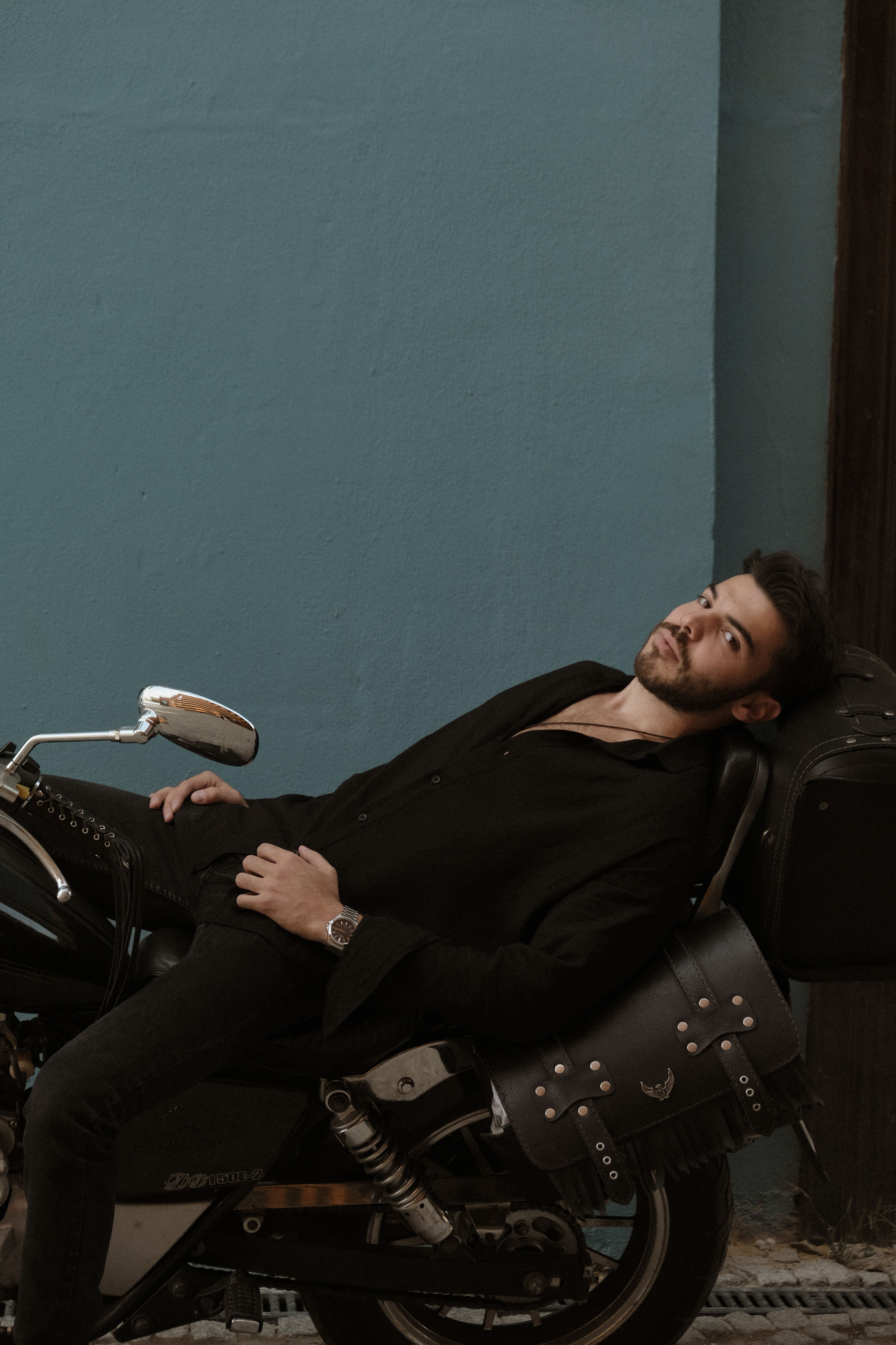 Man in Jacket Lying Down on Motorcycle · Free Stock Photo