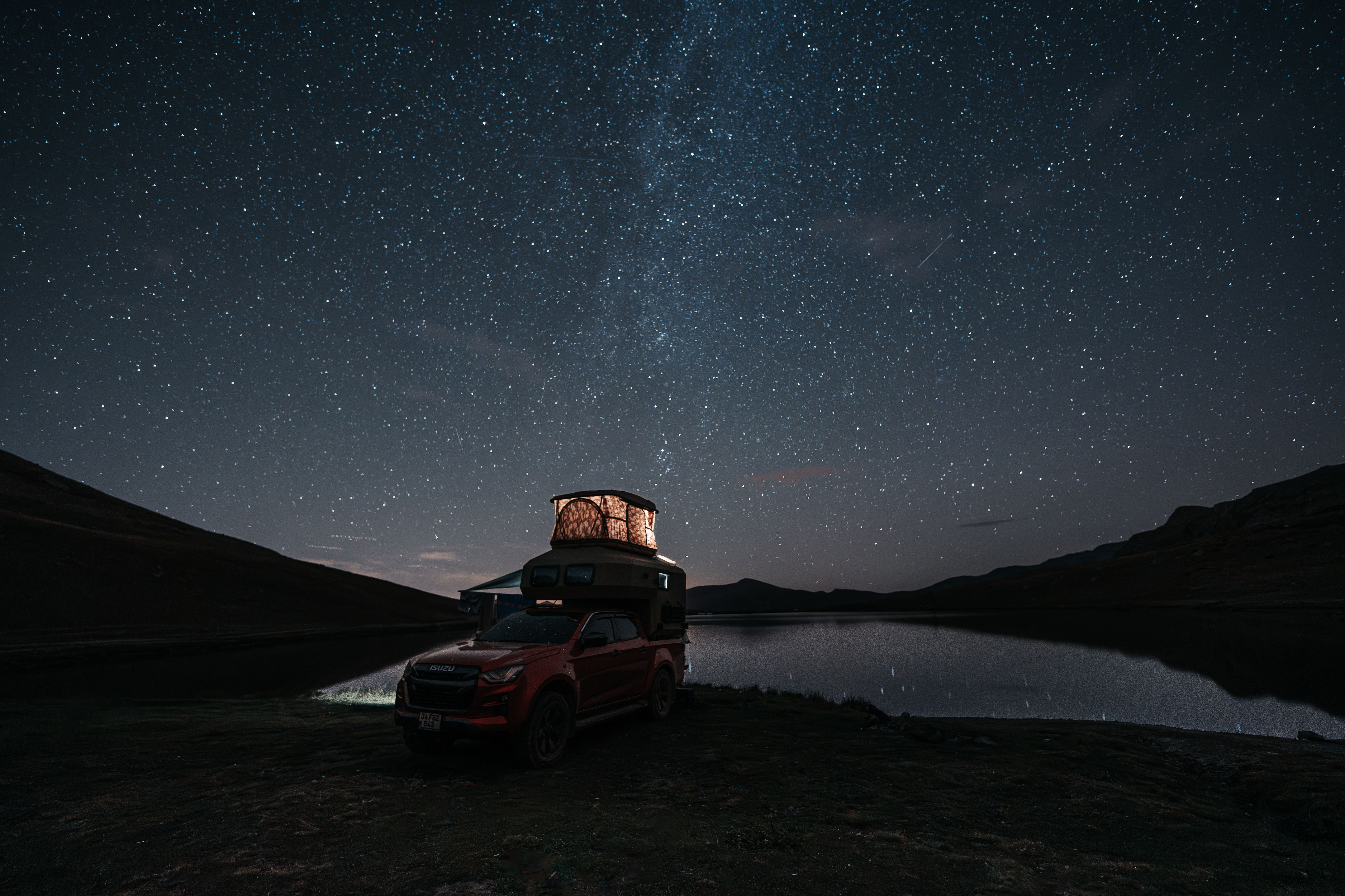 Pick-up with Cabin by Lake at Night · Free Stock Photo